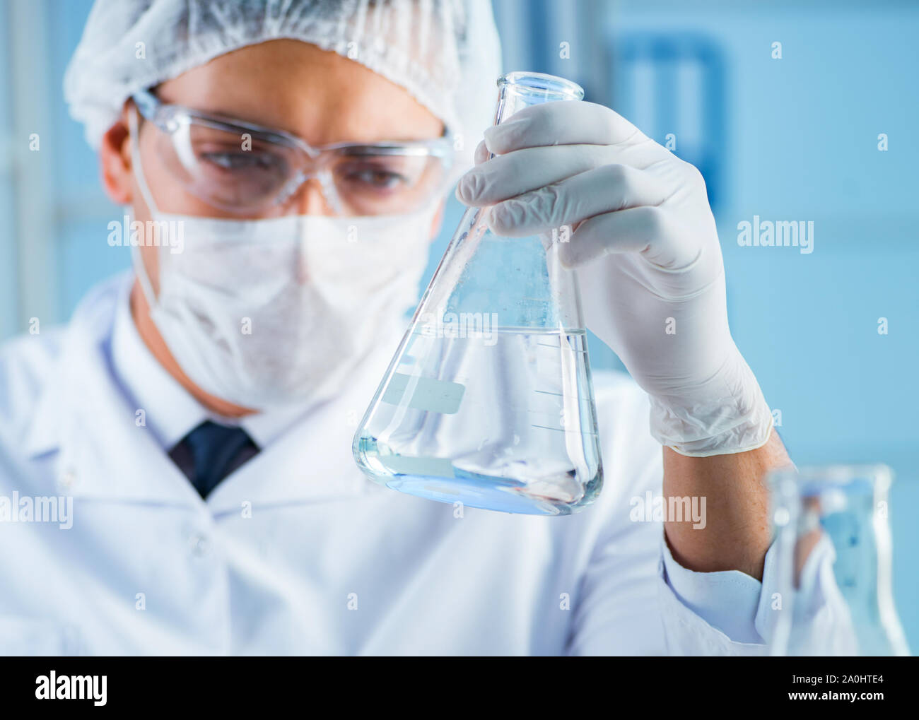 Female scientist researcher conducting an experiment in a laboratory ...
