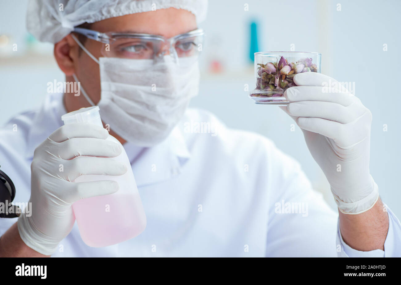The chemist mixing perfumes in the lab Stock Photo - Alamy