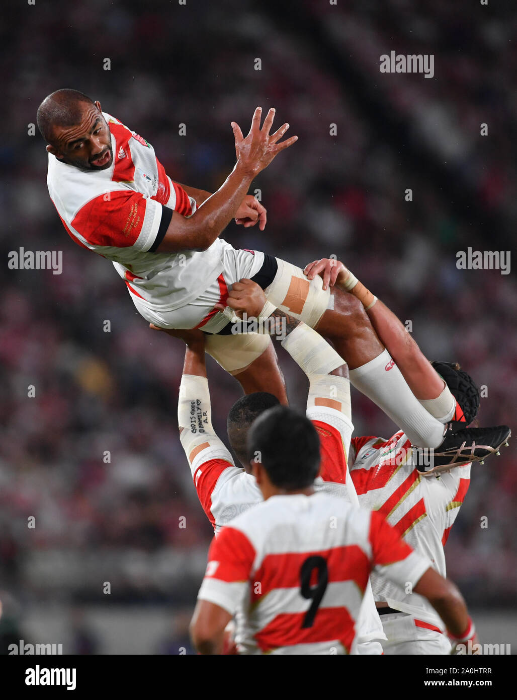 Japan's Michael Leitch (c) misjudges the restart during the Pool A ...