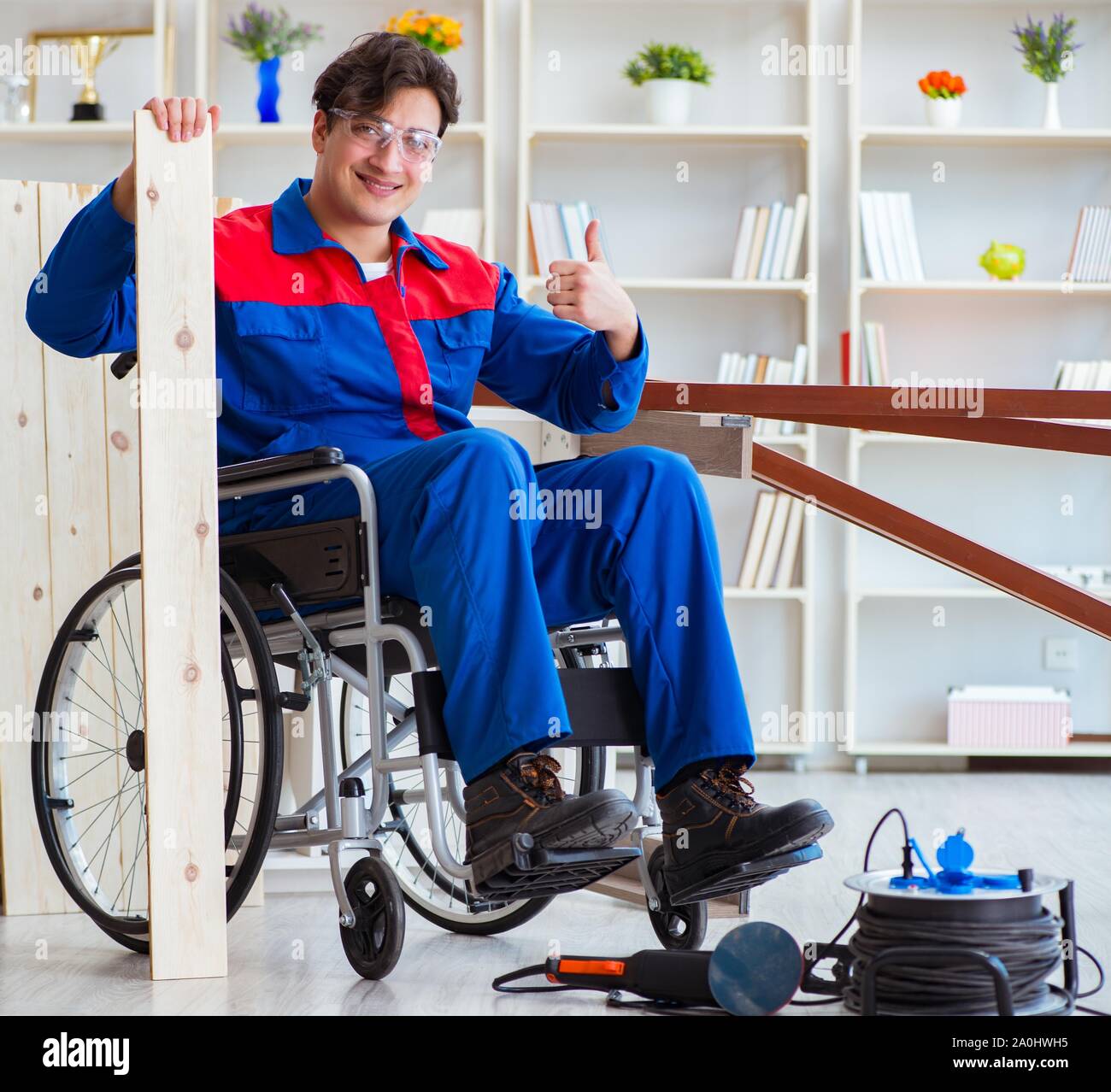 The disabled carpenter working in workshop Stock Photo - Alamy