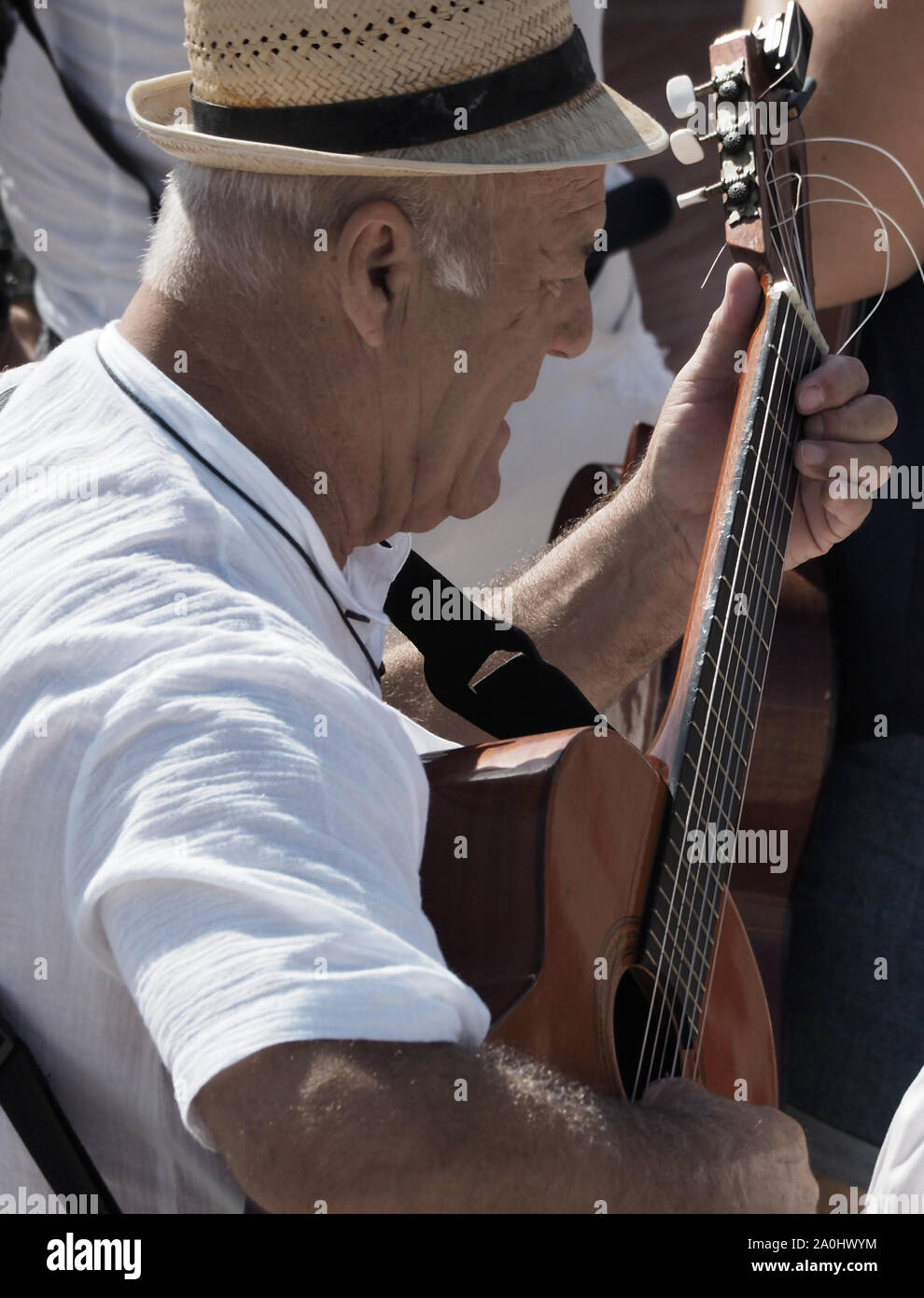 Old man playing music instruments hi-res stock photography and images ...