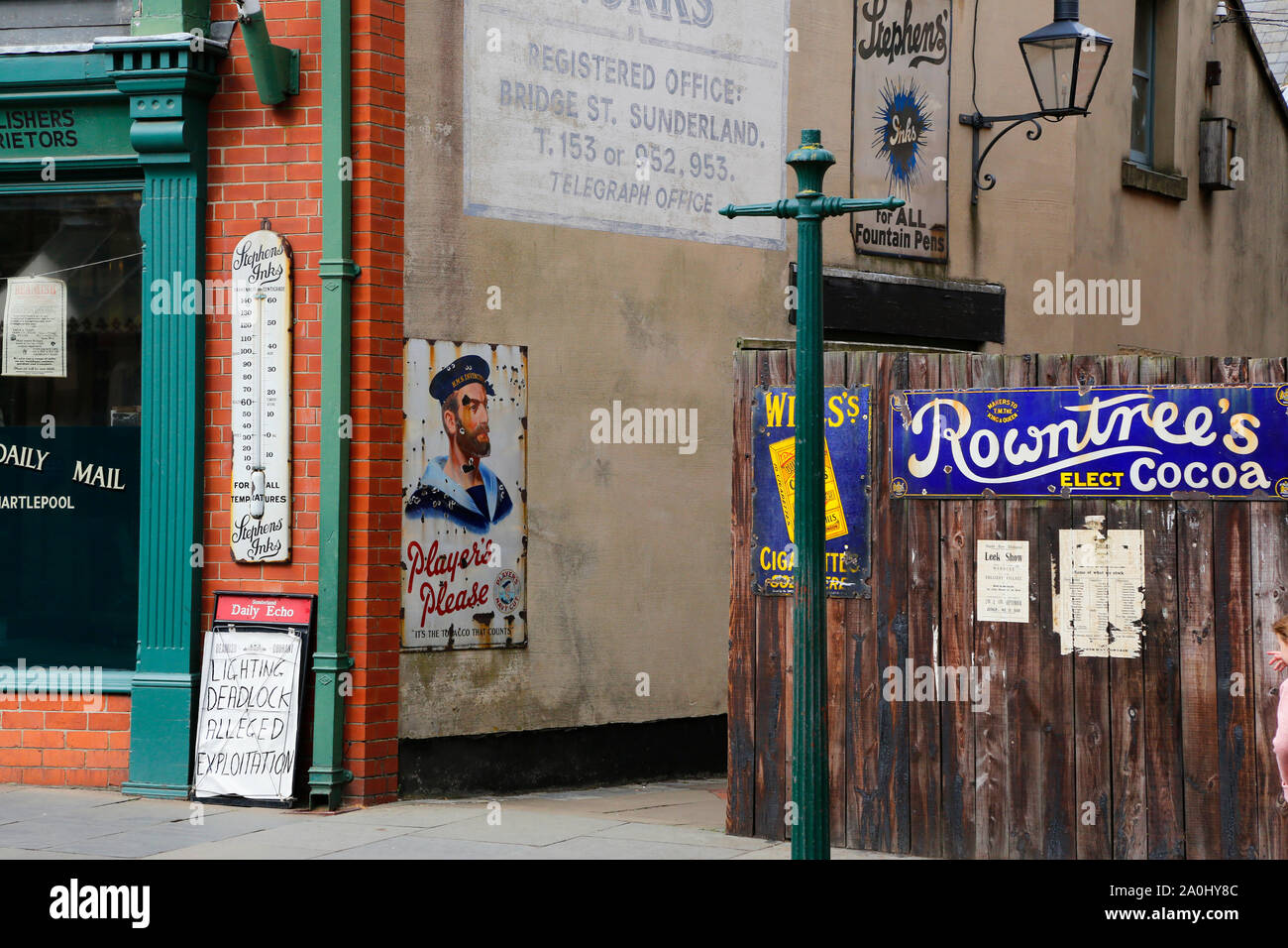 Old advertising signs put to good use Stock Photo - Alamy