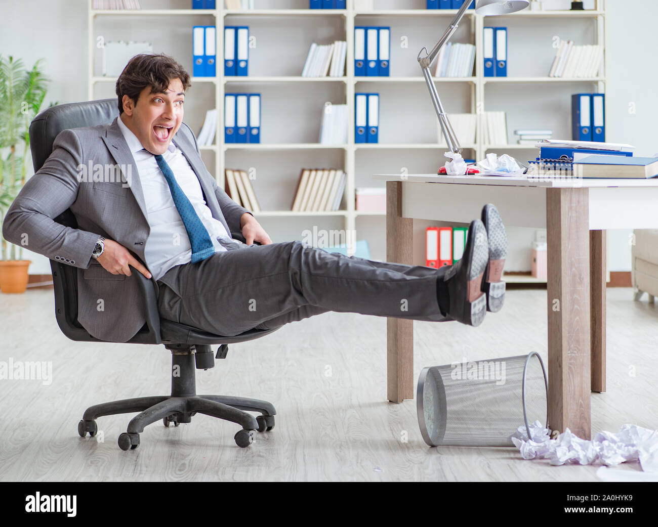 The businessman having fun taking a break in the office at work Stock ...