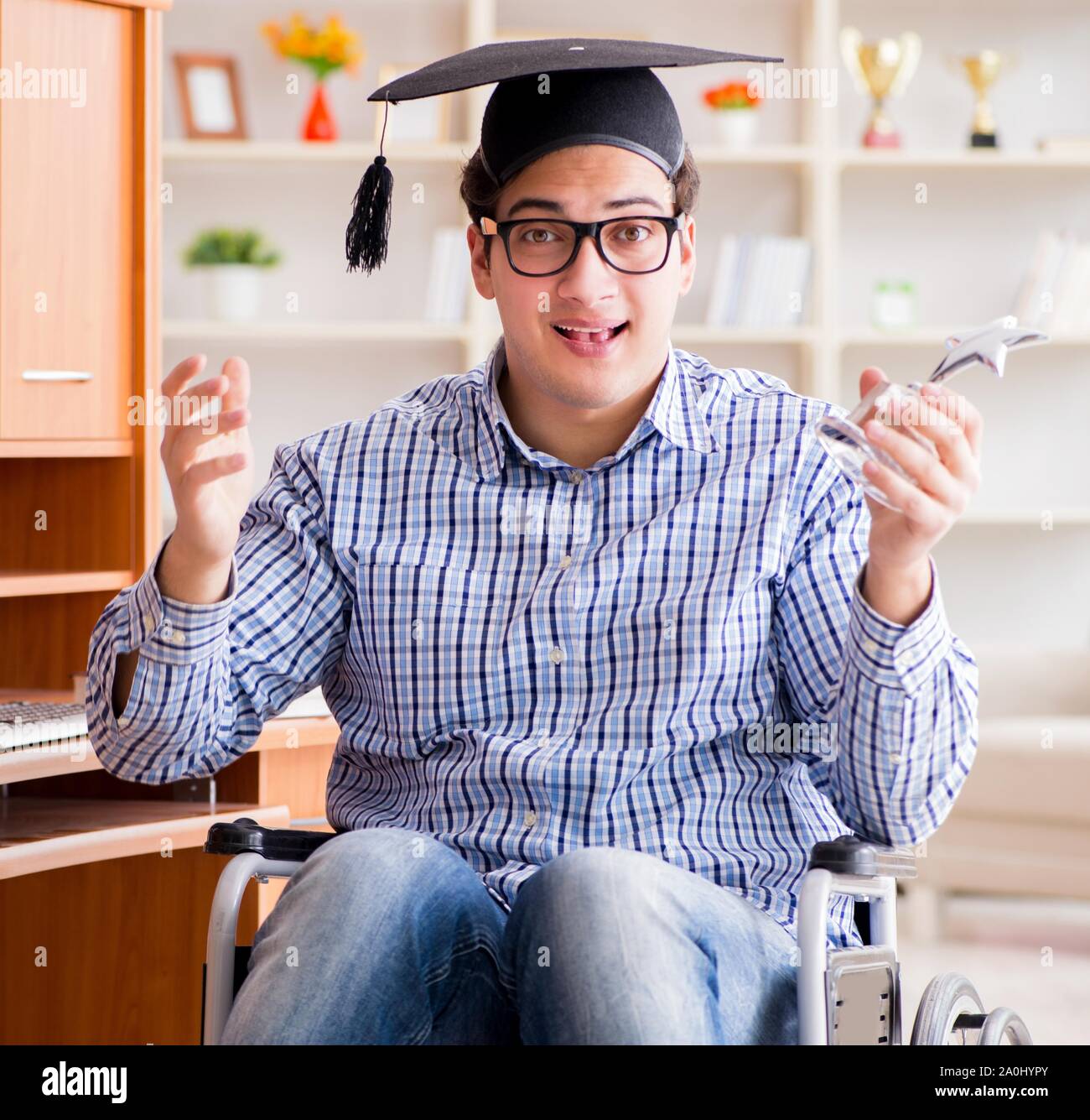 The disabled student studying at home on wheelchair Stock Photo - Alamy