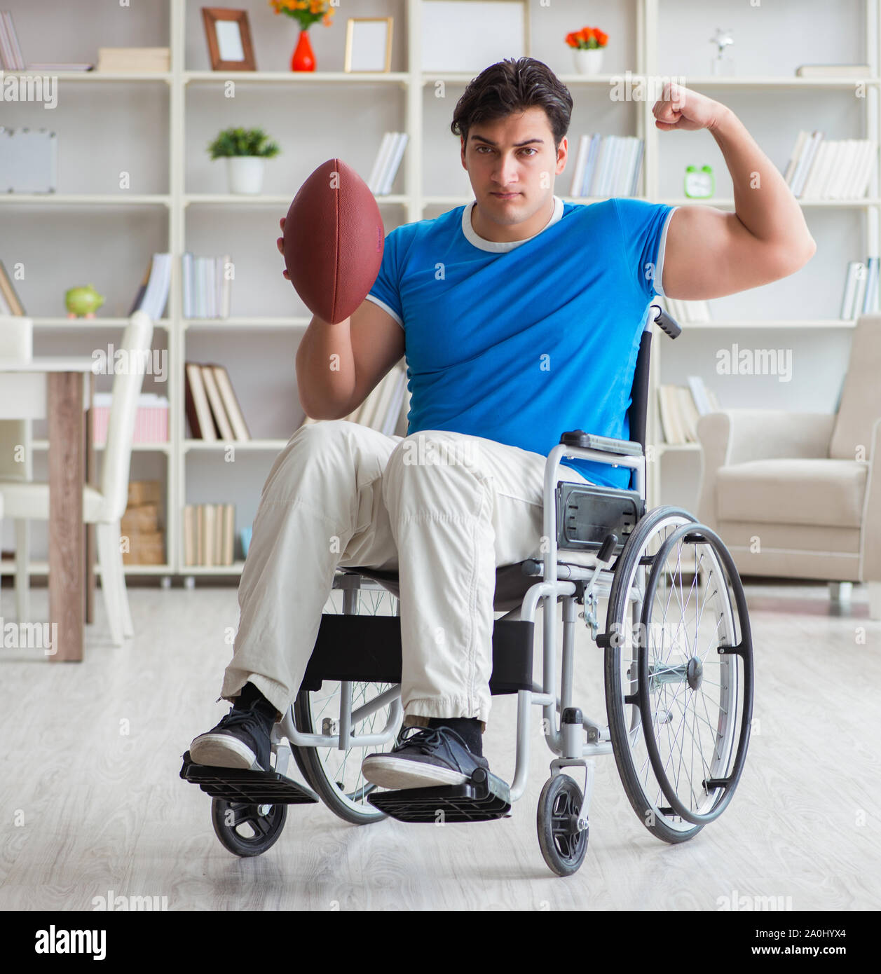 The young man american football player recovering on wheelchair Stock ...