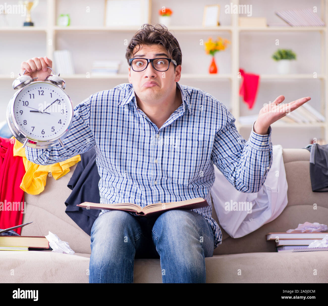 The young man working studying in messy room Stock Photo - Alamy