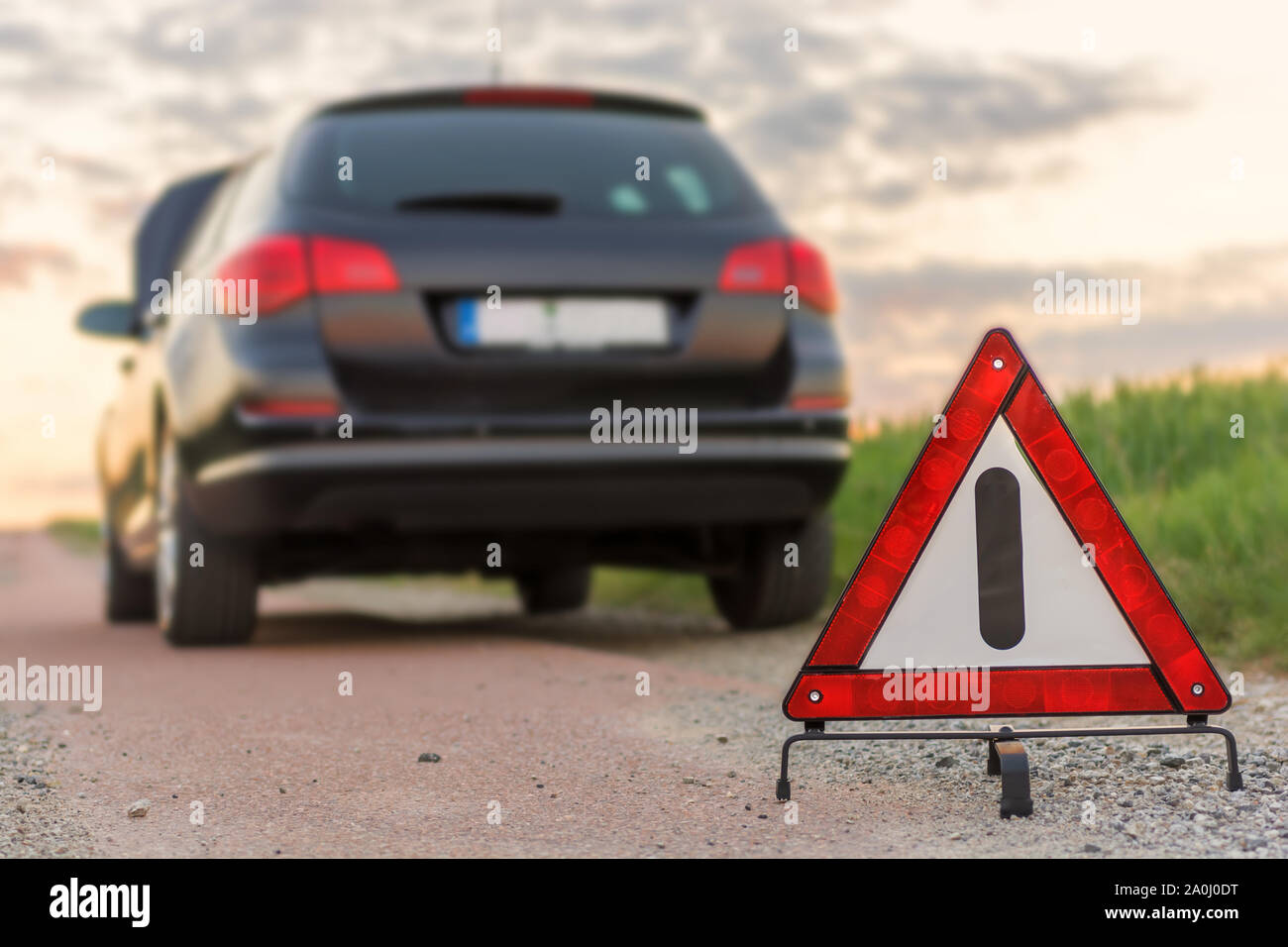 Warning triangle at car breakdown Stock Photo - Alamy