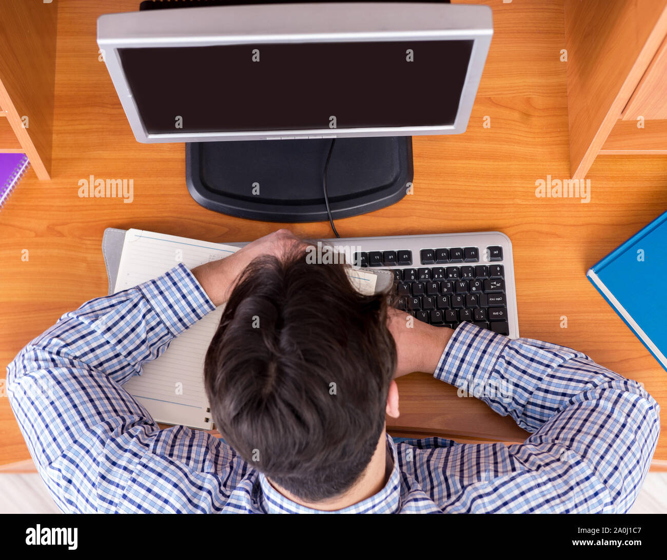 The young student at computer table Stock Photo - Alamy