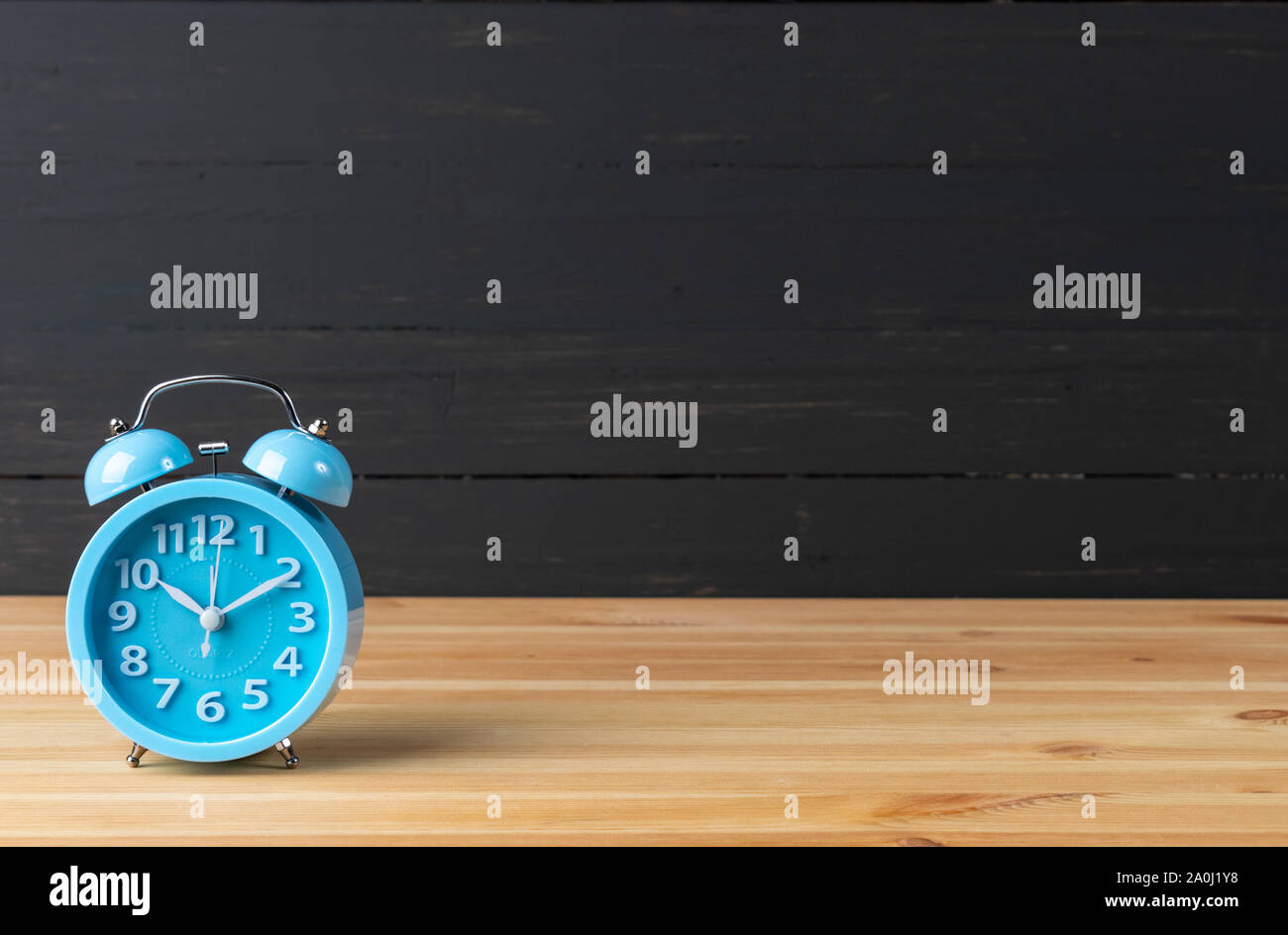 Alarm clock on the table. Time management concept Stock Photo - Alamy