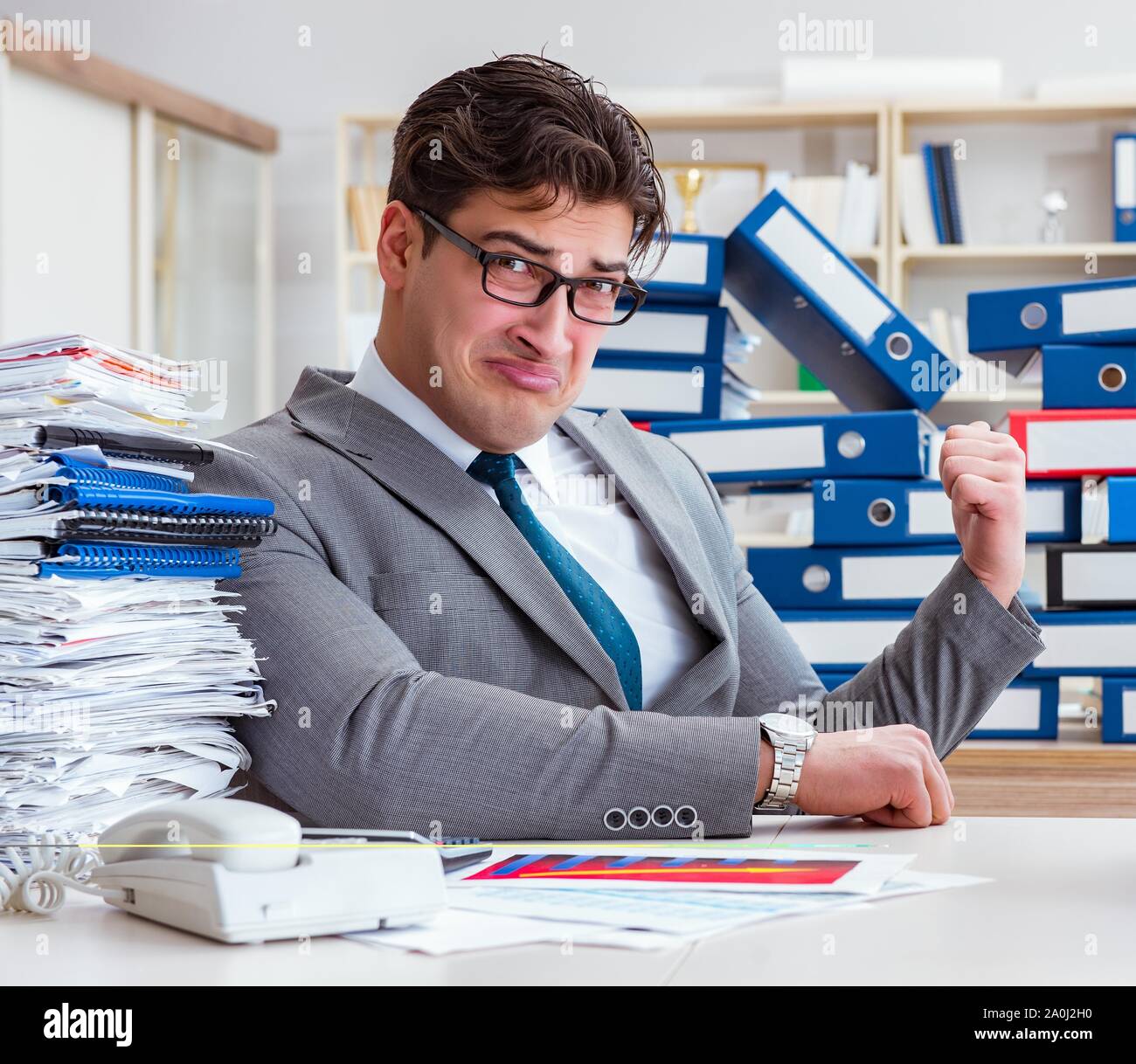 The businessman busy with much paperwork Stock Photo - Alamy