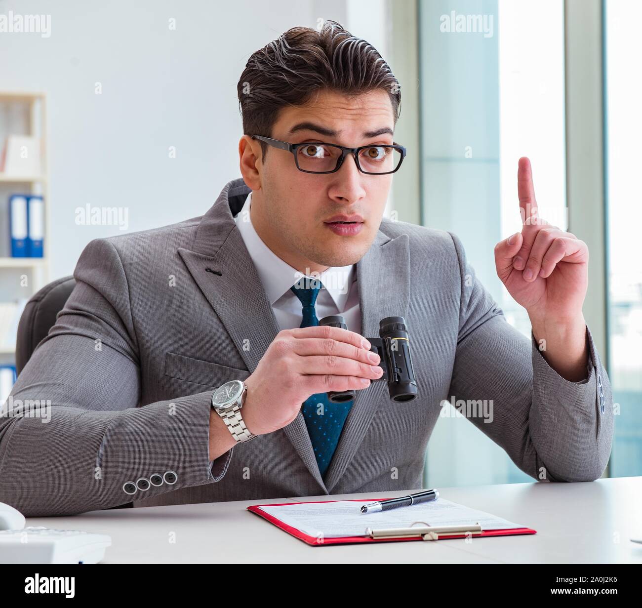The man looking for errors and mistakes in report Stock Photo - Alamy