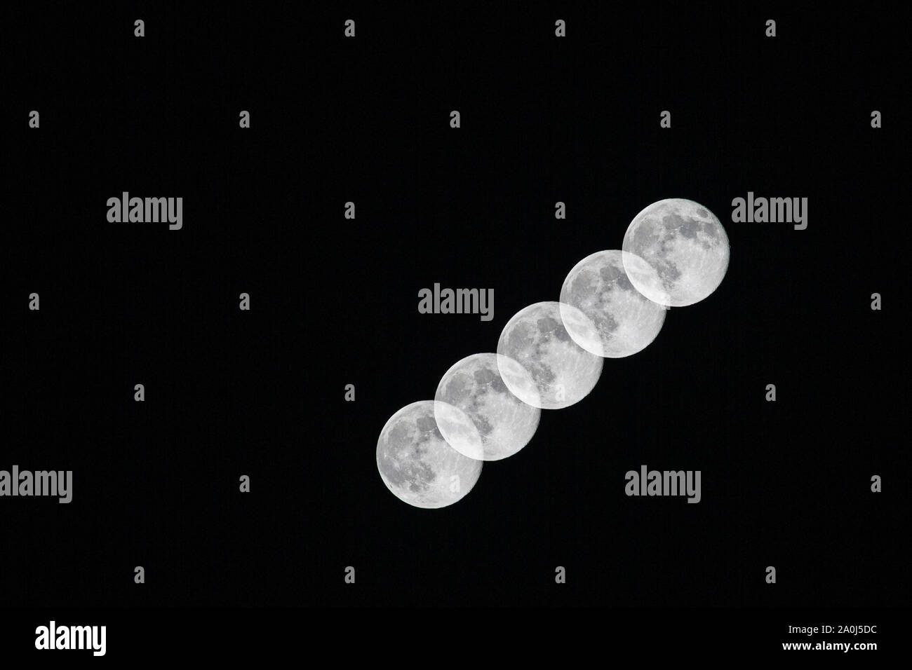 A multiple exposure frame of the full moon seen in Colorado Stock Photo ...