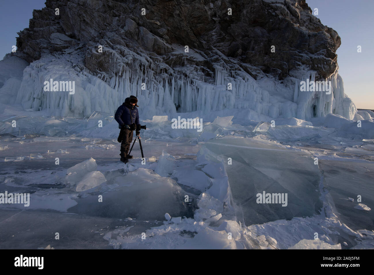 Photographer over Baikal lake Ice Stock Photo - Alamy