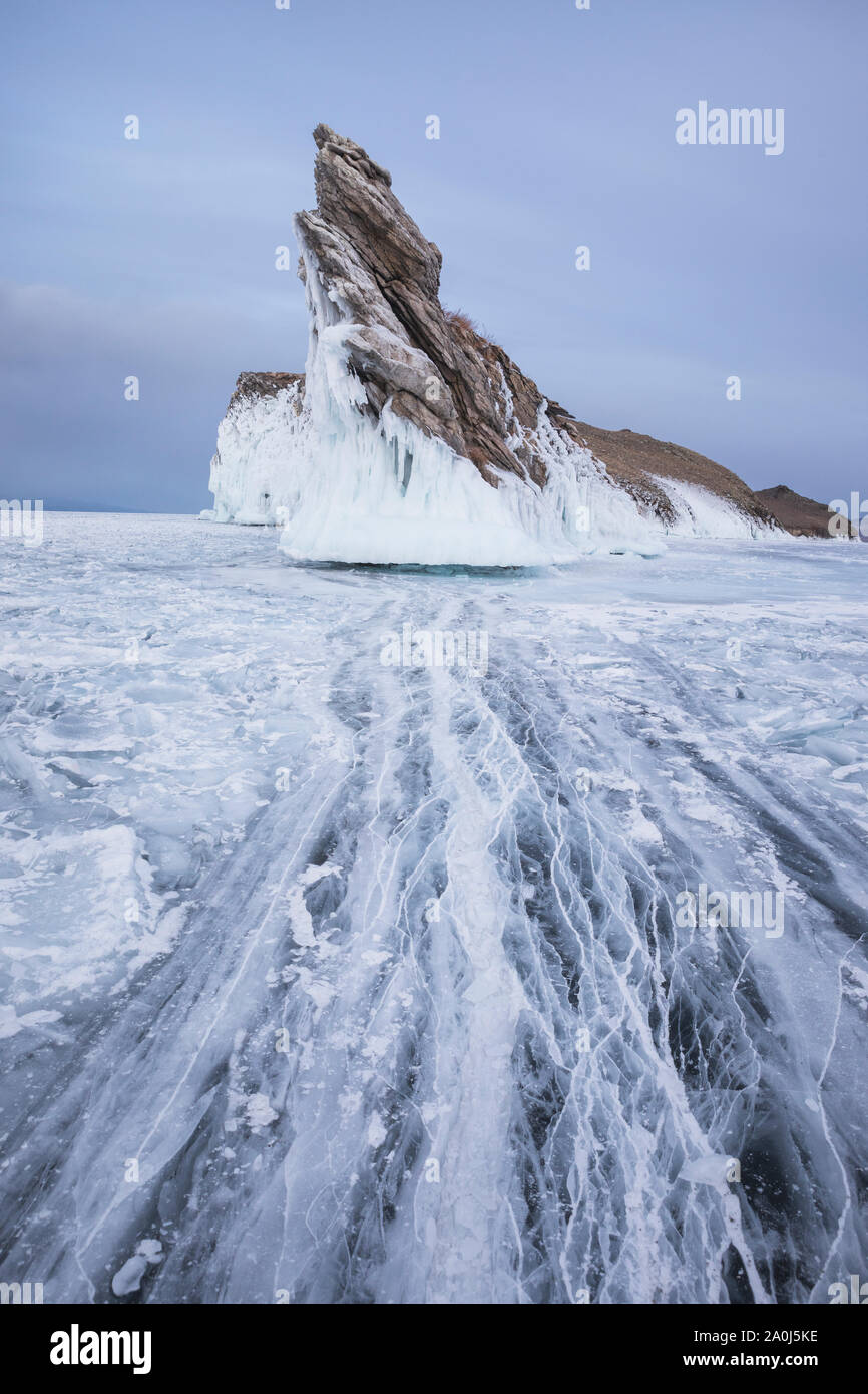 rocky cliff surrounded by ice Stock Photo - Alamy