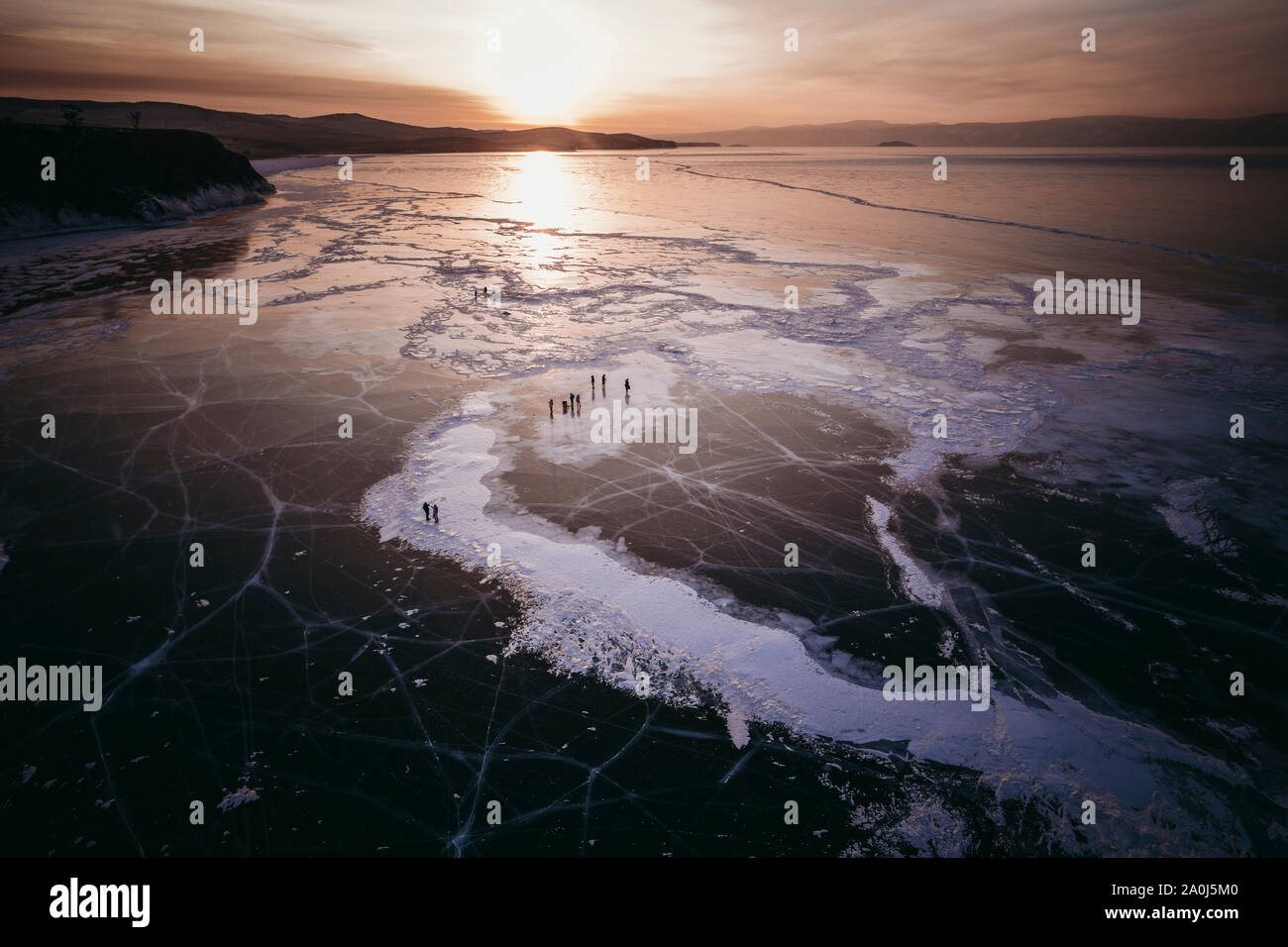 people over ice textures and cracks from overhead view Stock Photo - Alamy