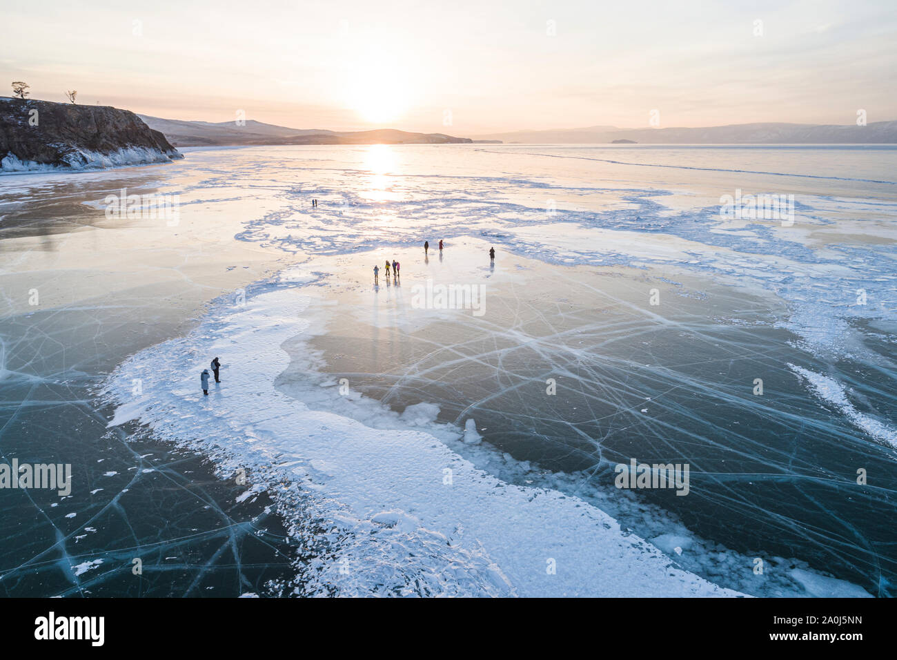 people over ice textures and cracks from overhead view Stock Photo - Alamy