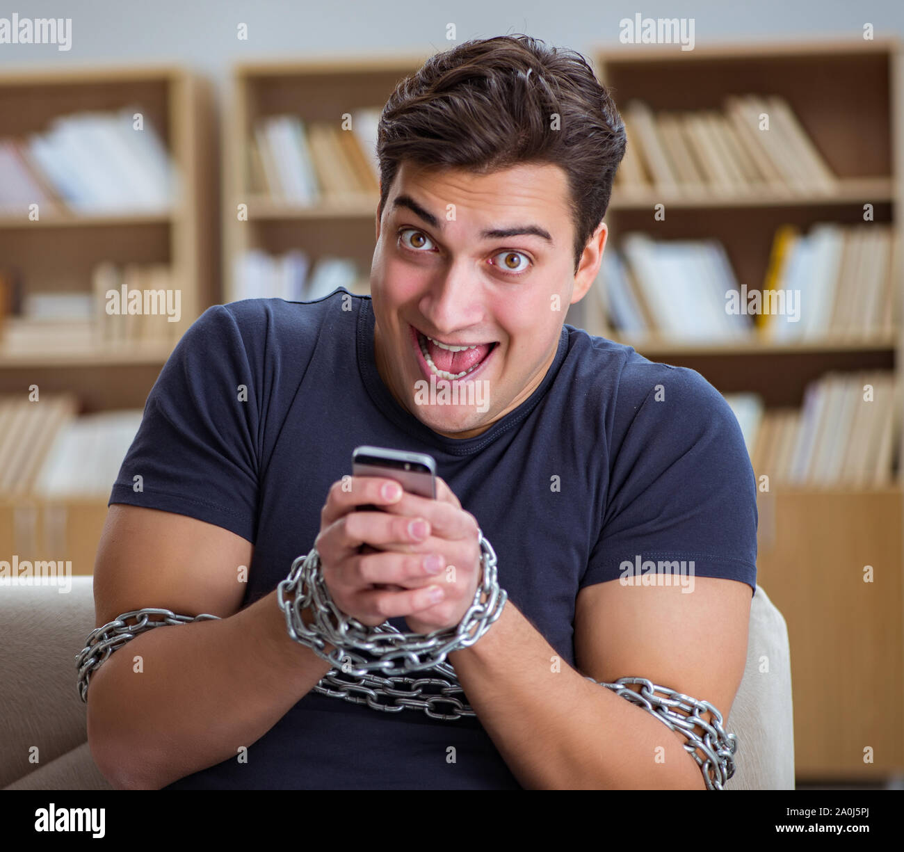 The man suffering from phone dependence addiction Stock Photo - Alamy
