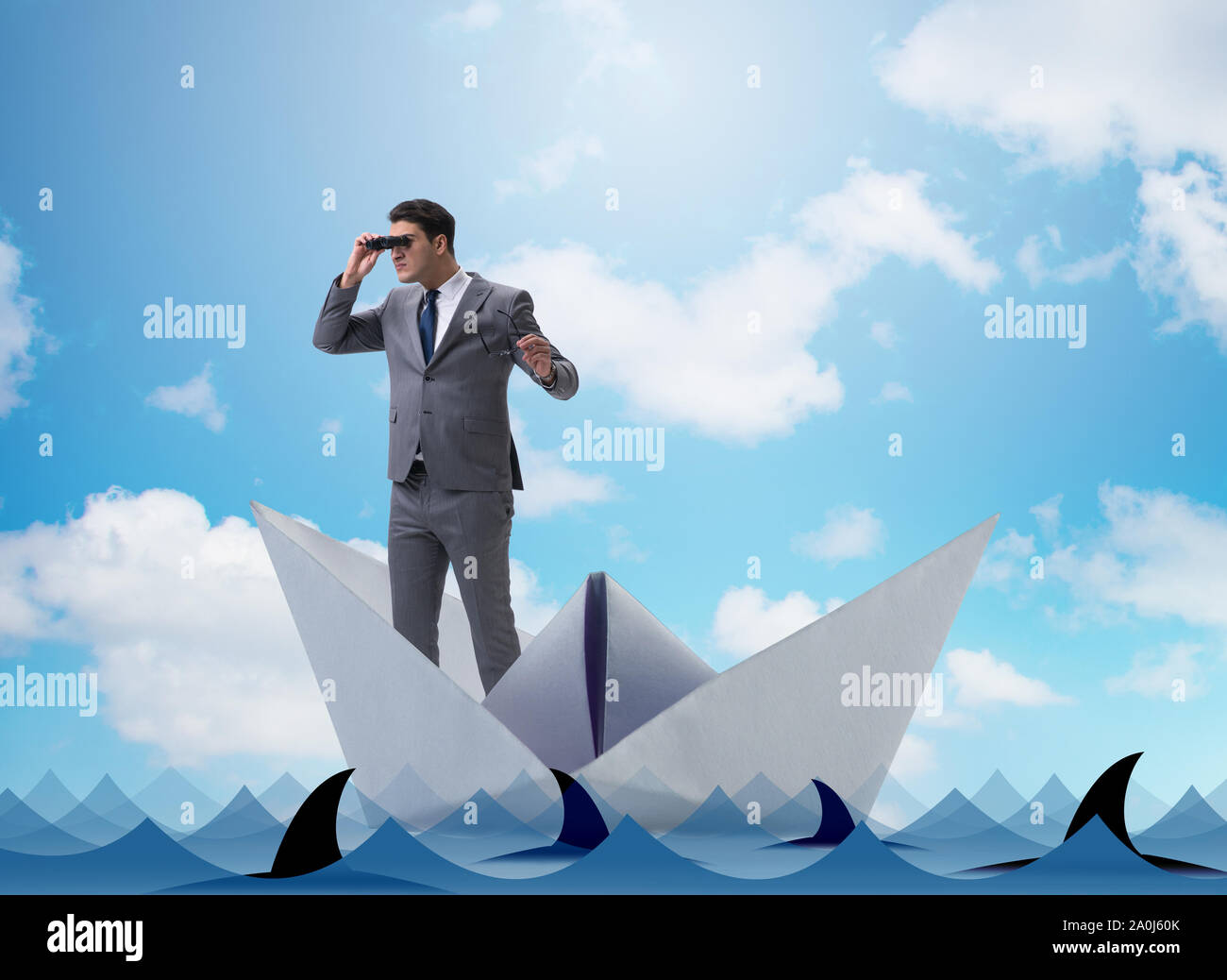Businessman looking into future with binoculars in paper ship boat ...