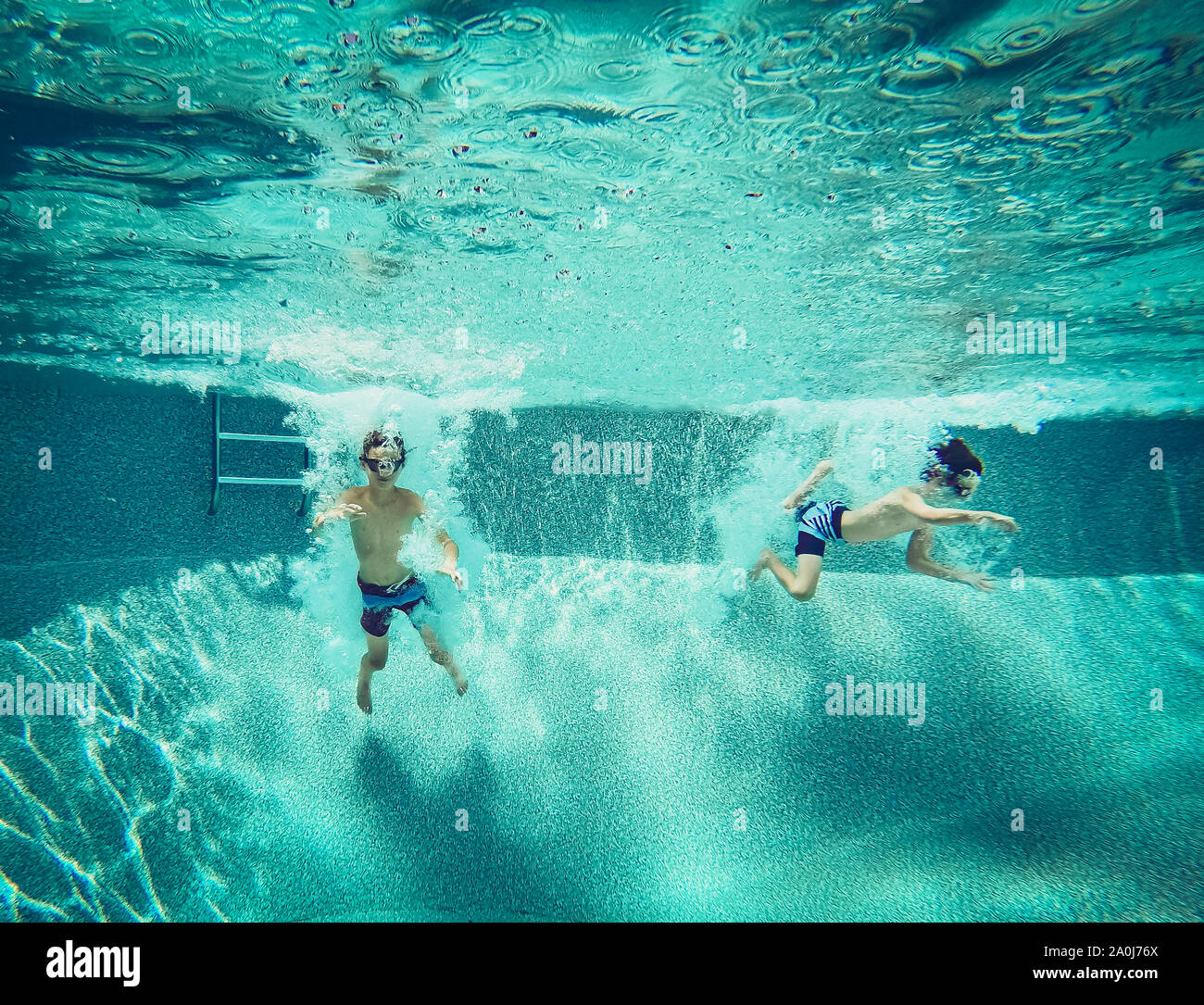 Boys jumping water hi-res stock photography and images - Alamy