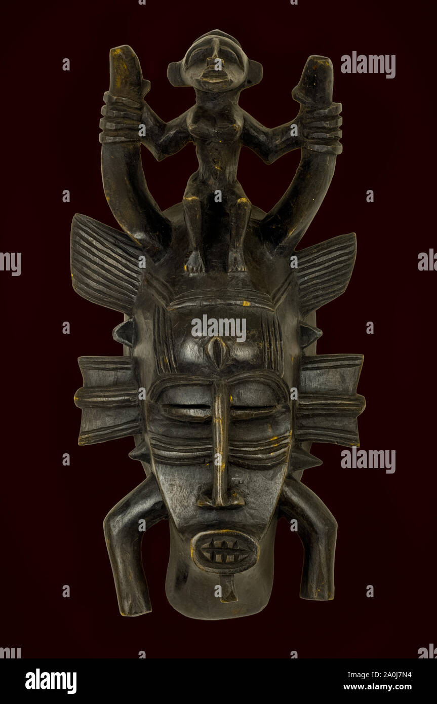 Senufo mask from West Africa, carved in wood isolated on black Stock ...