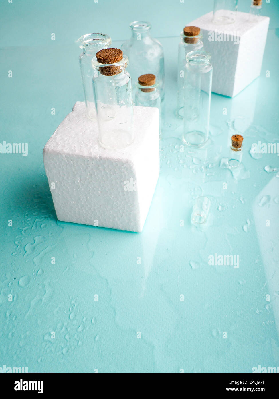 Few transparent bottles, water sprays. empty glass bottles Stock Photo ...