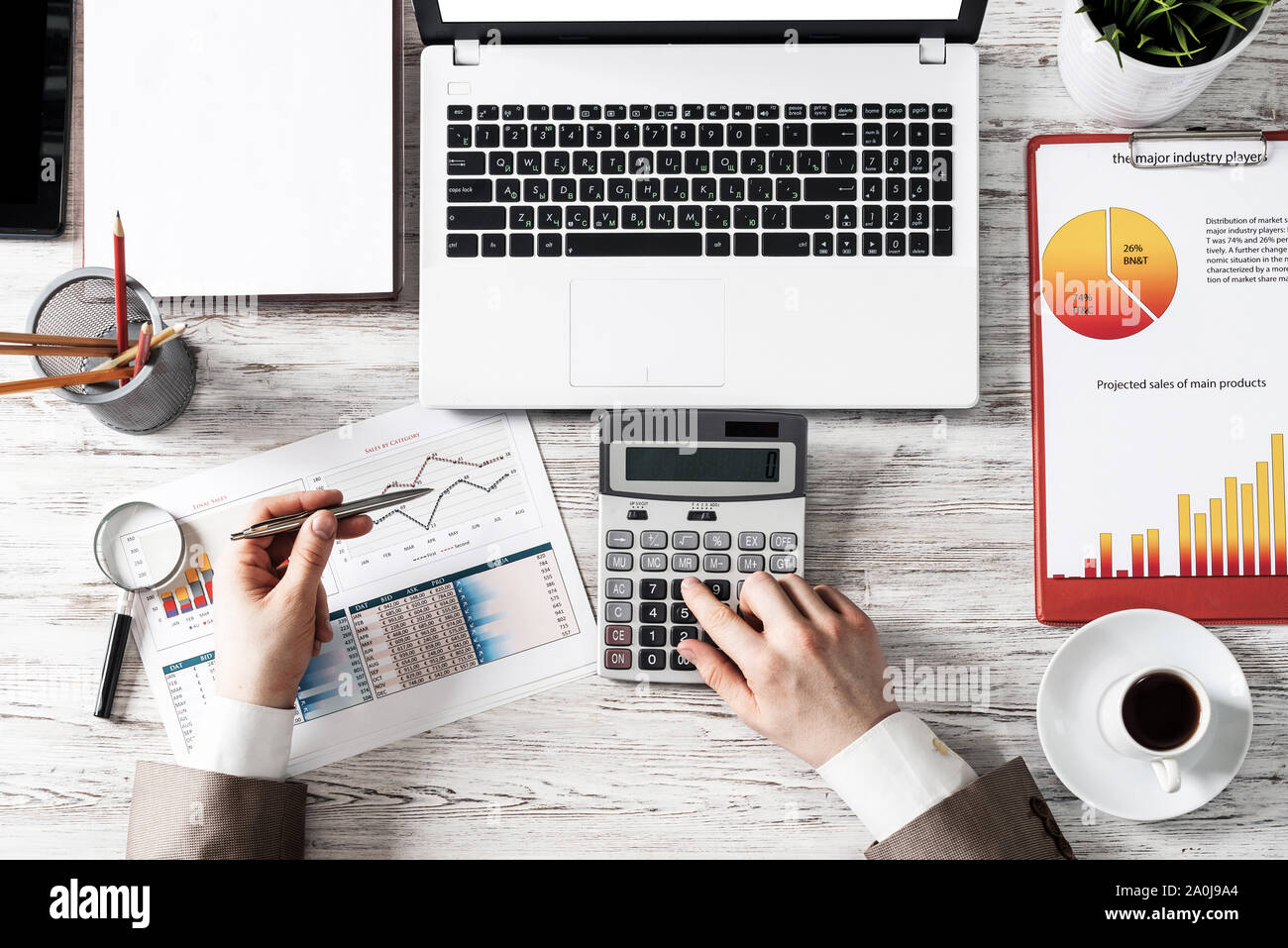 Businessman working at office desk with financial data. Top view office ...
