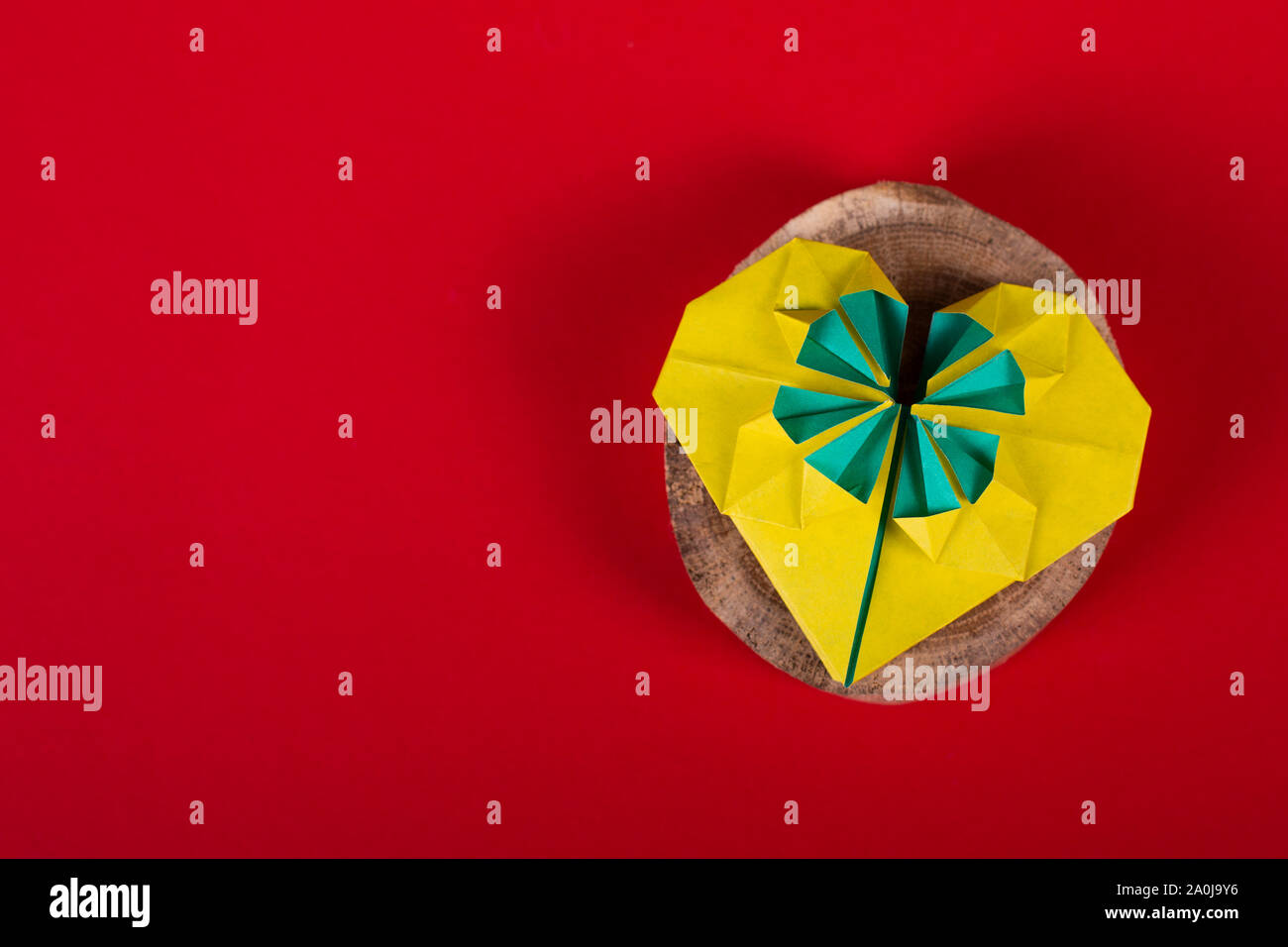 Concept of love sign yellow handmade papercraft origami crafted colored ...