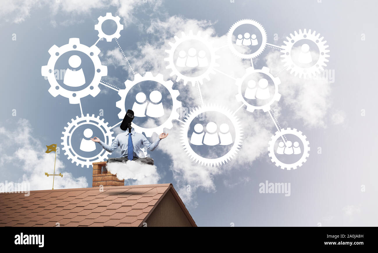 Faceless businessman with camera zoom instead of head sitting in lotus ...