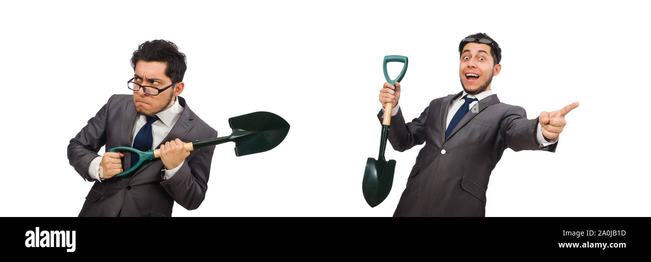 The young businessman holding a spade isolated on white Stock Photo - Alamy