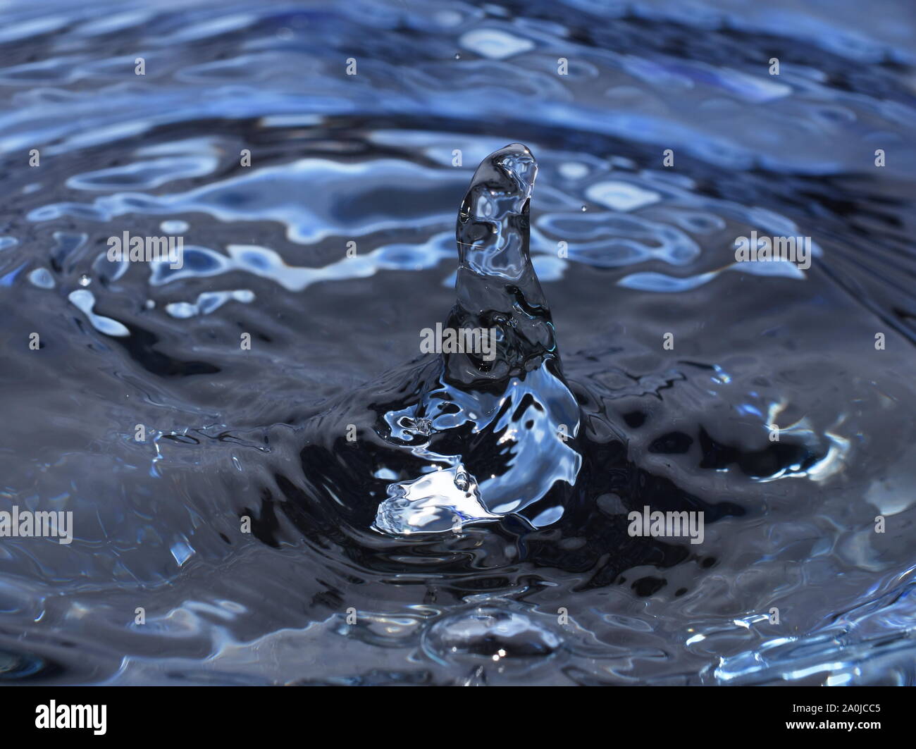 Blue water splash black background hi-res stock photography and images ...