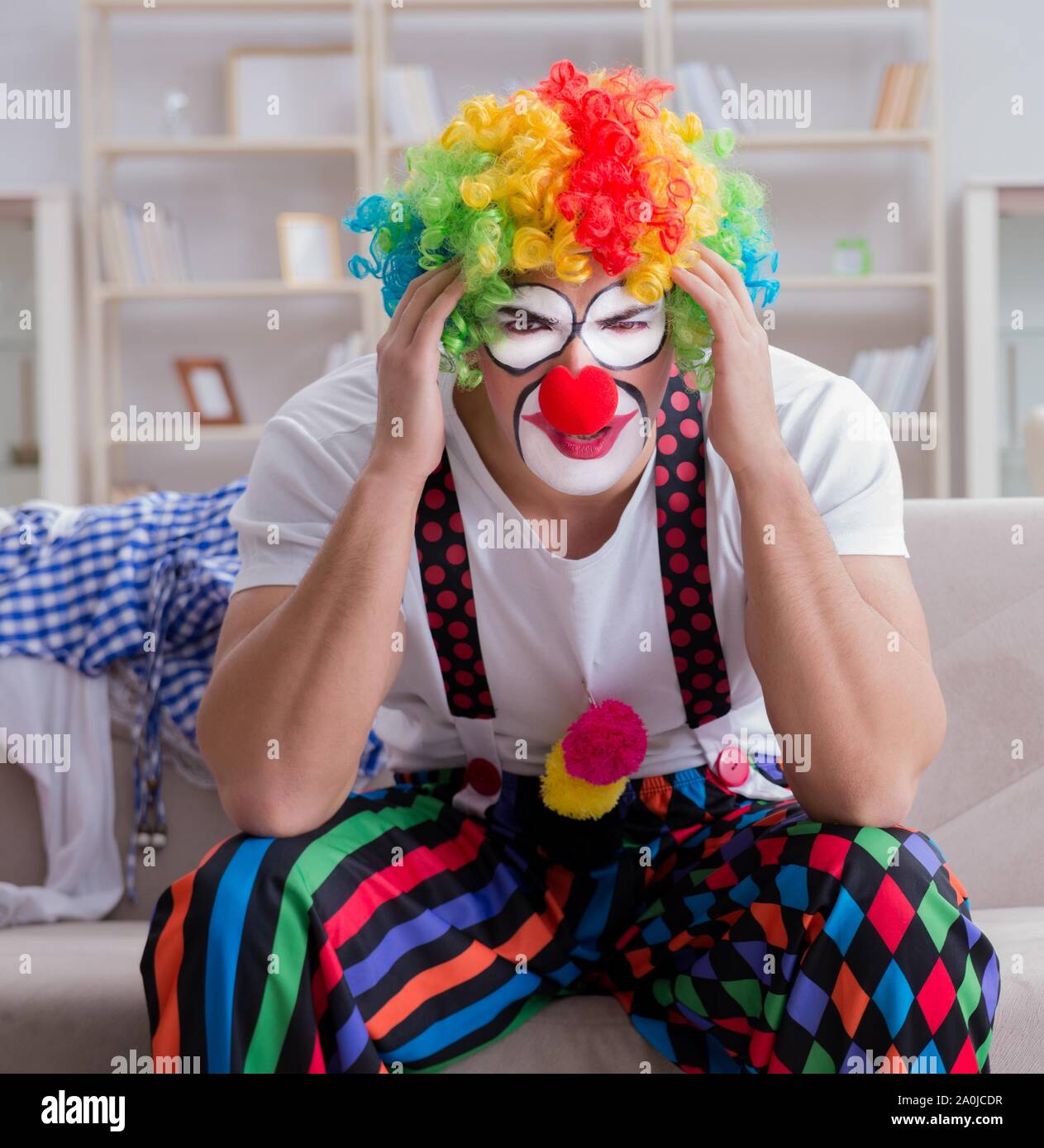 The drunk clown celebrating having a party at home Stock Photo - Alamy
