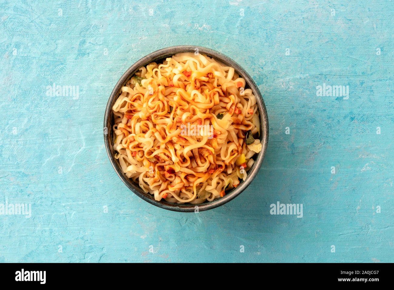 Instant soba noodles with carrot and a sauce, shot from the top on a ...
