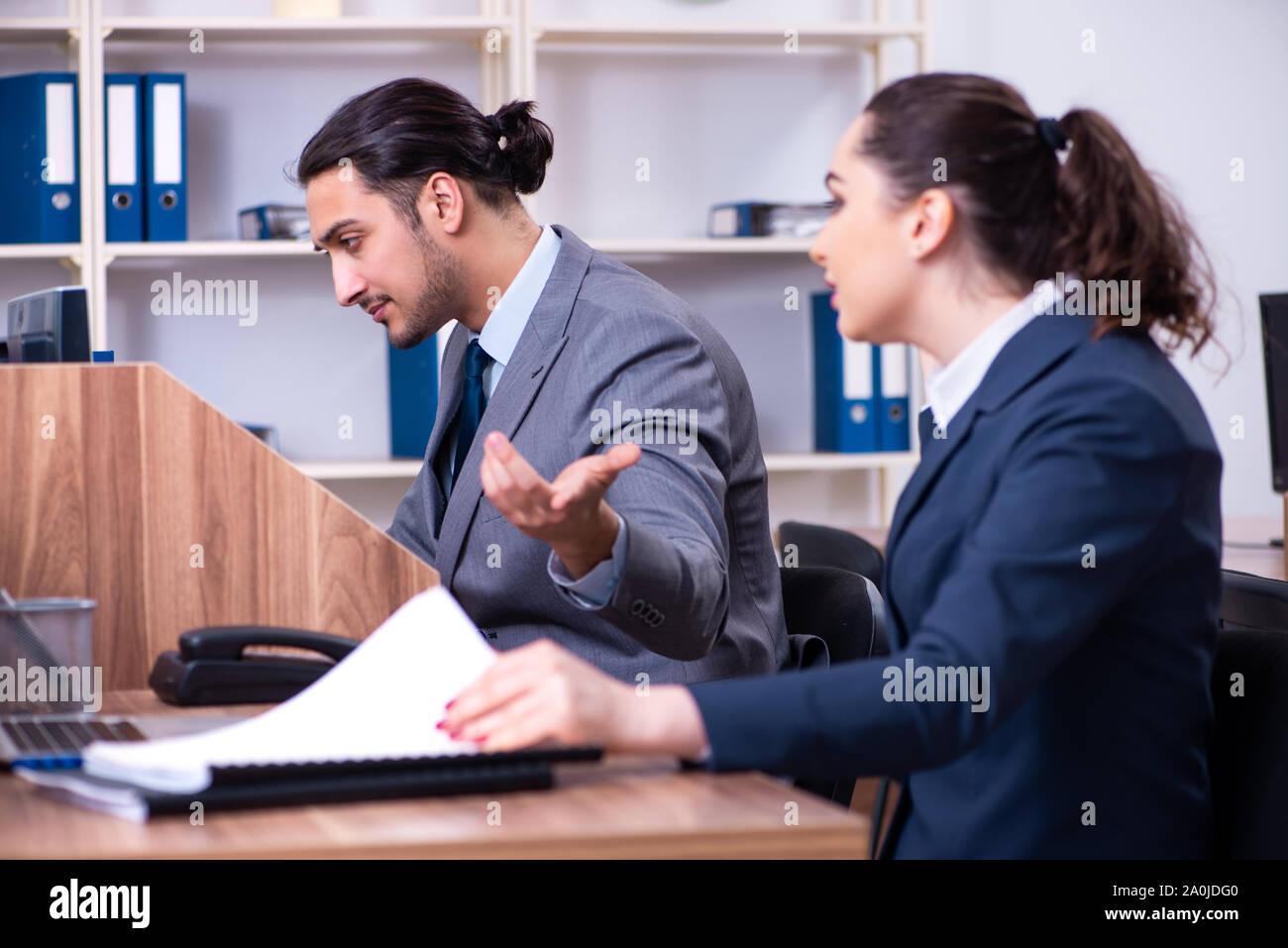The two employees working in the office Stock Photo - Alamy