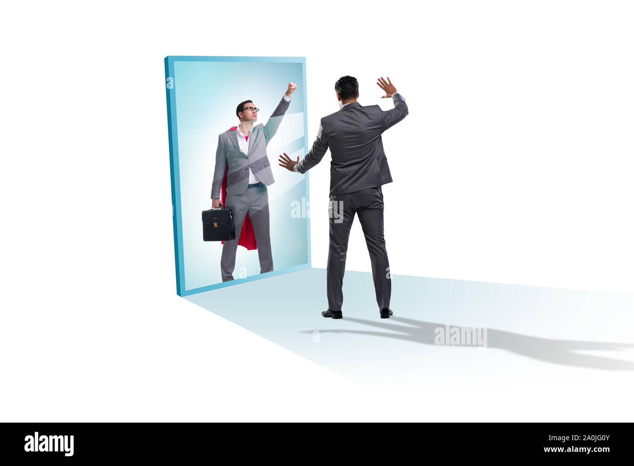 The businessman seeing himself in mirror as superhero Stock Photo - Alamy