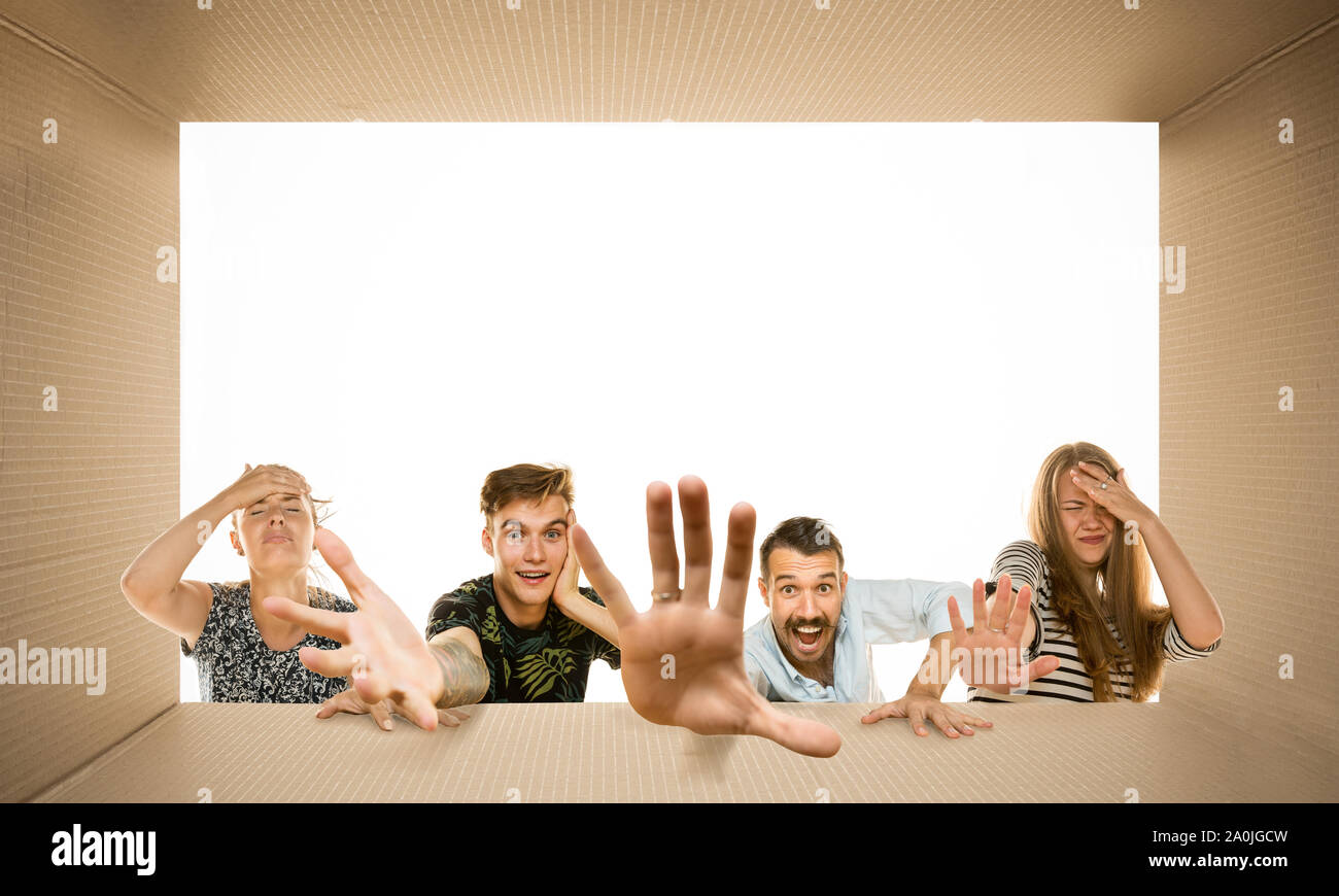 Shocked and astonished people opening the biggest postal package ...