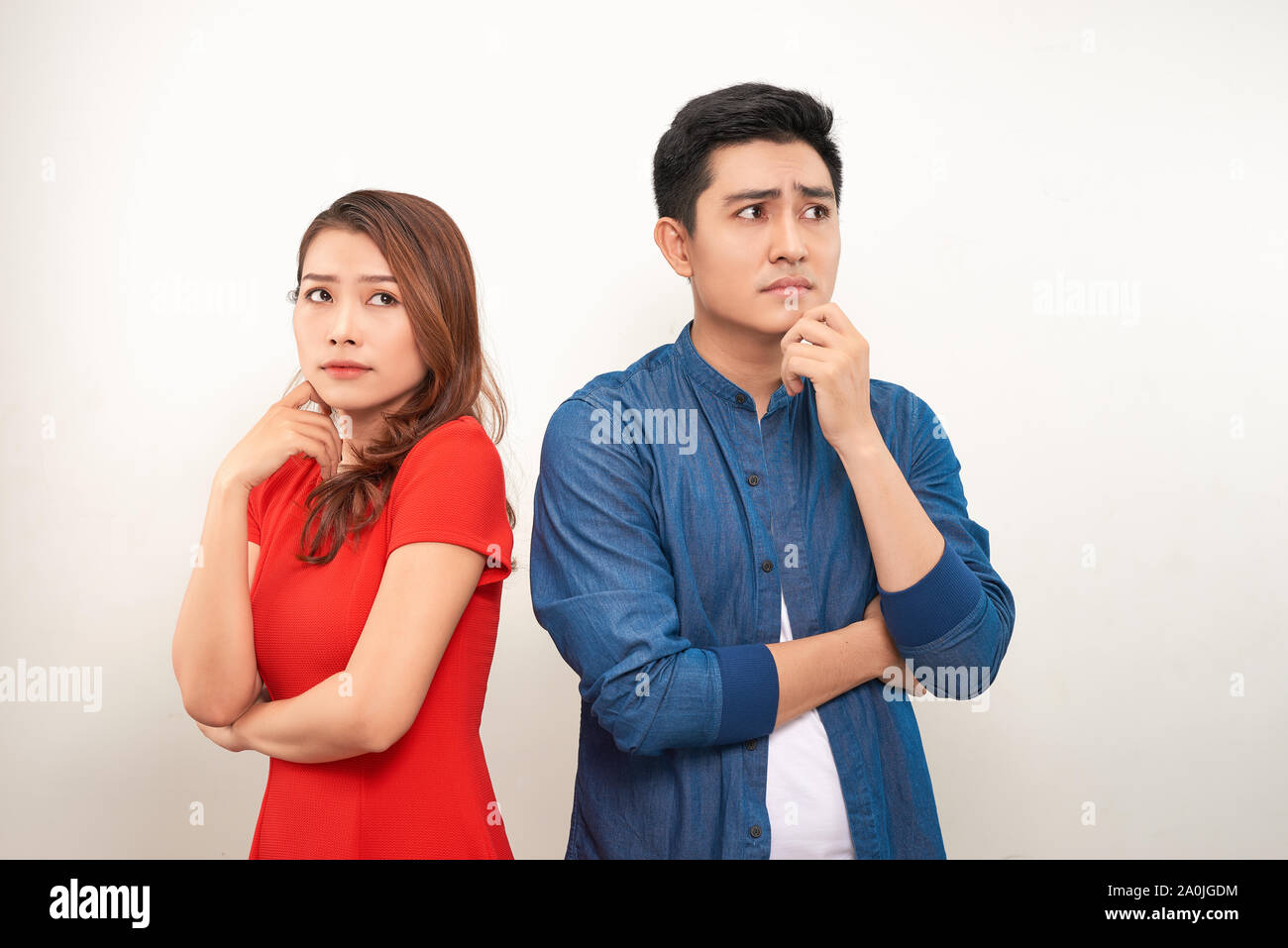 Young angry couple in love standing back to back Stock Photo - Alamy