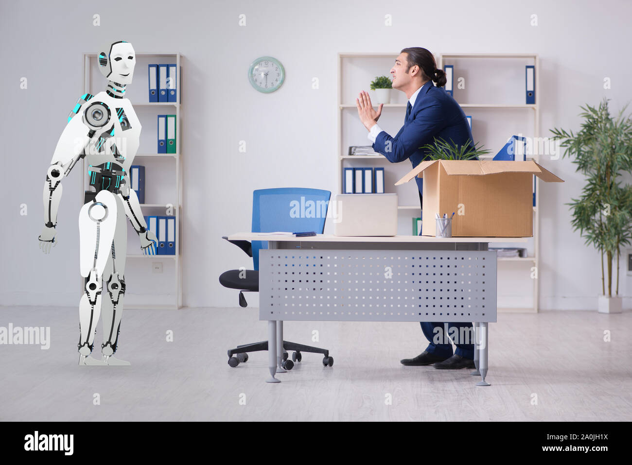 The concept of robots replacing humans in offices Stock Photo - Alamy