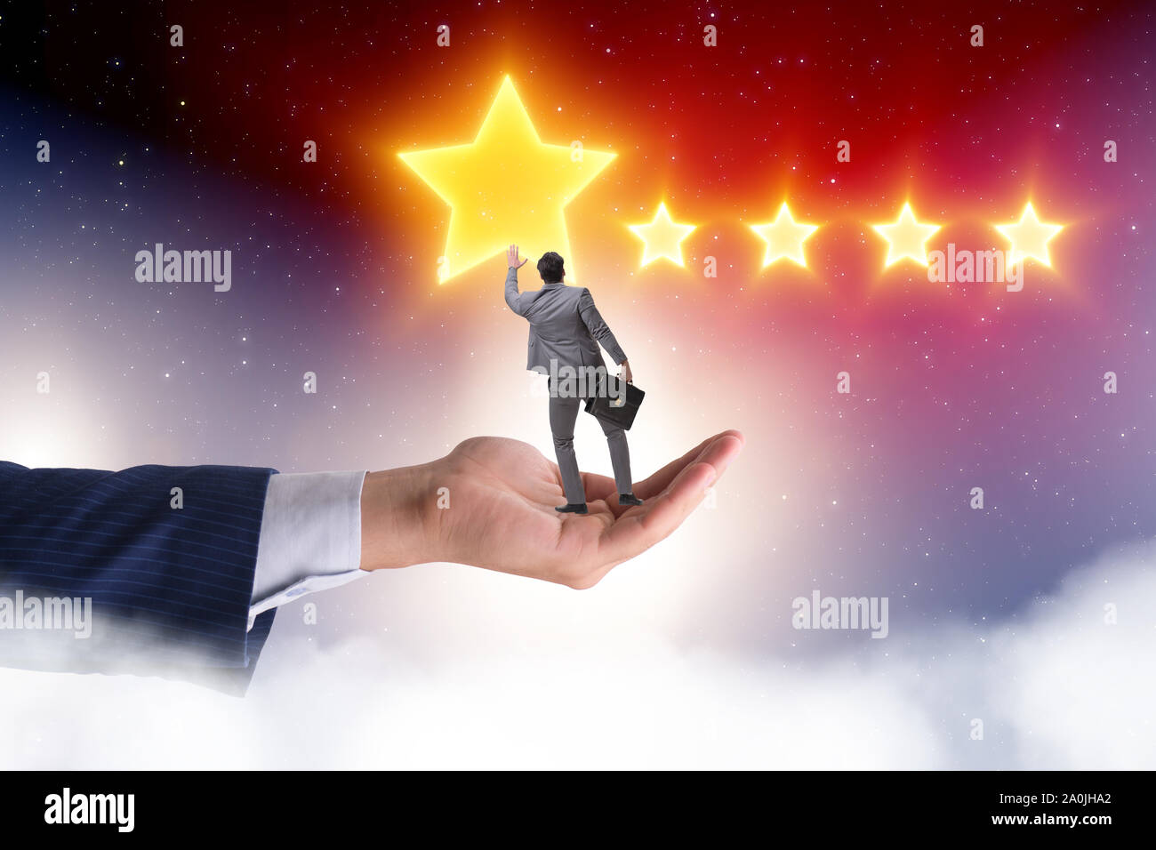 The businessman held on hand reaching out for stars Stock Photo - Alamy