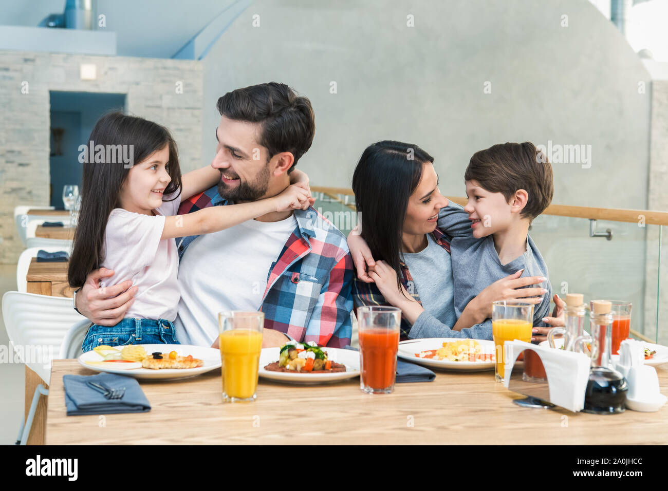 Family Sitting Together in the Restaurant Lunch Concept Stock Photo - Alamy