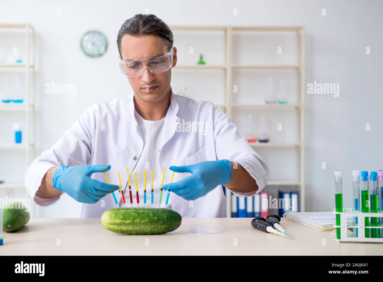 The male nutrition expert testing vegetables in lab Stock Photo - Alamy