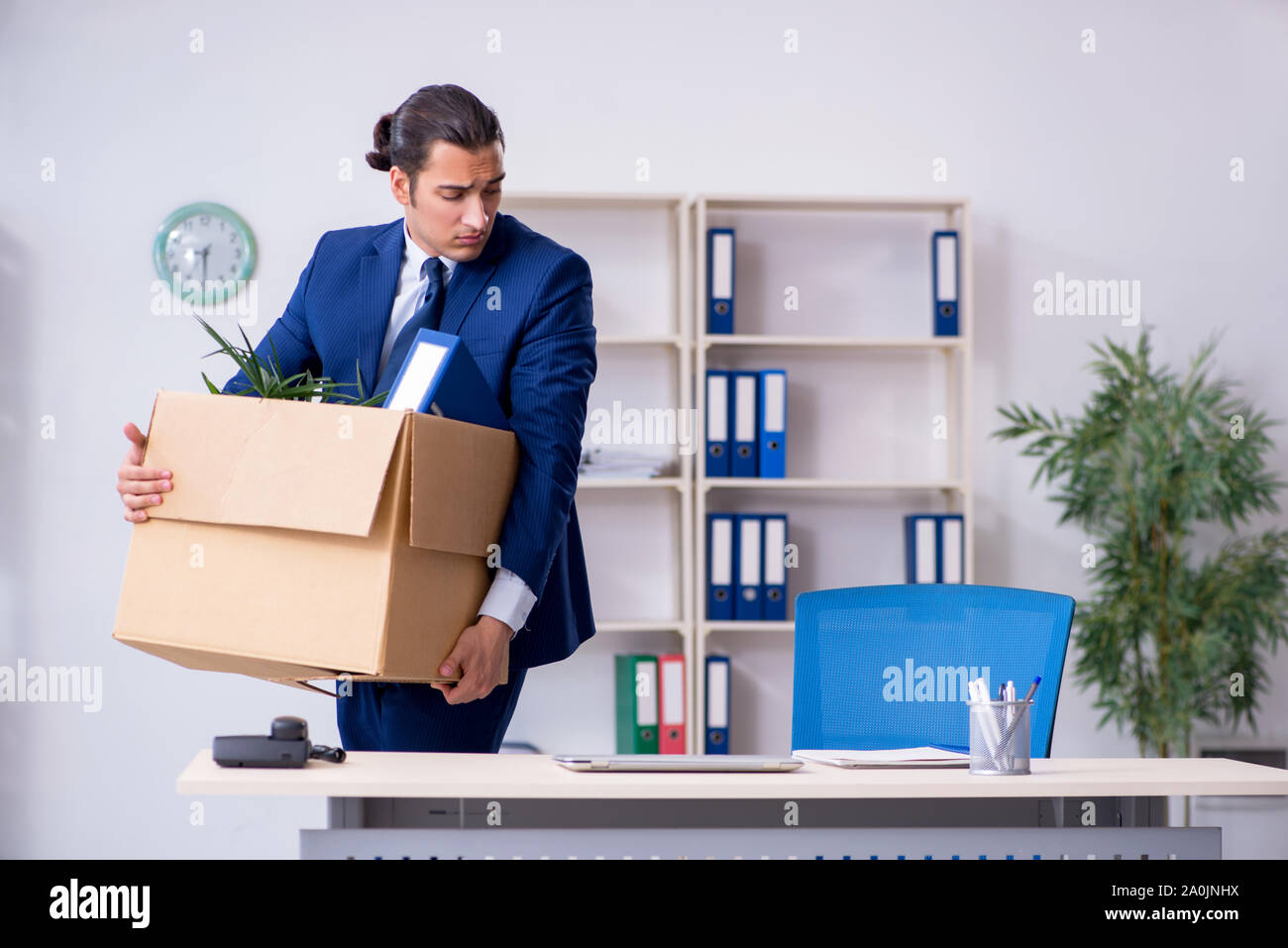 The young employee being made redundant Stock Photo - Alamy