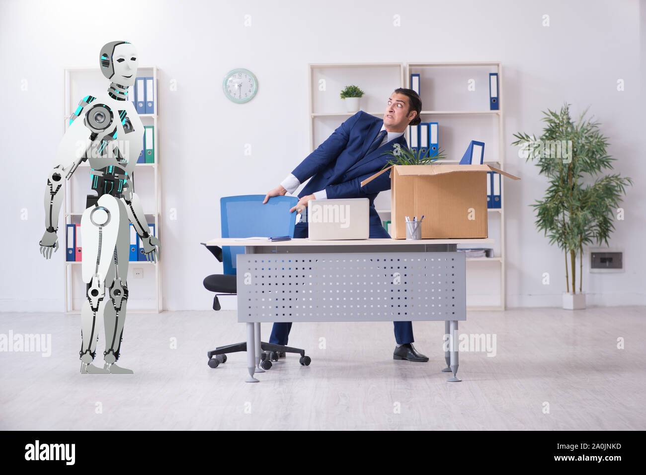 The concept of robots replacing humans in offices Stock Photo - Alamy