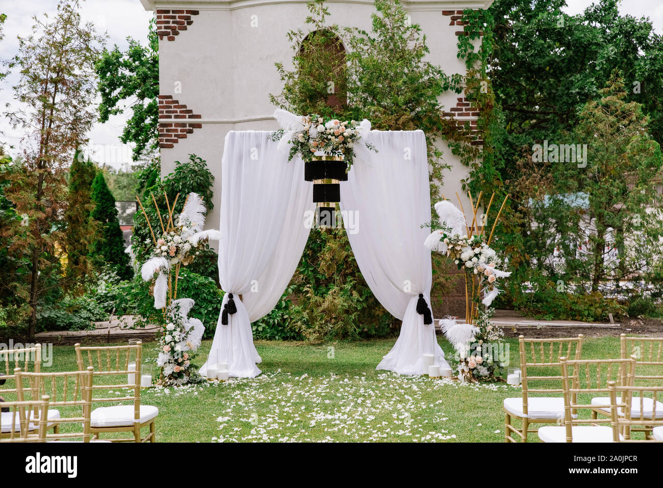 The square arch is decorated with aerial white cloth and stylish black ...
