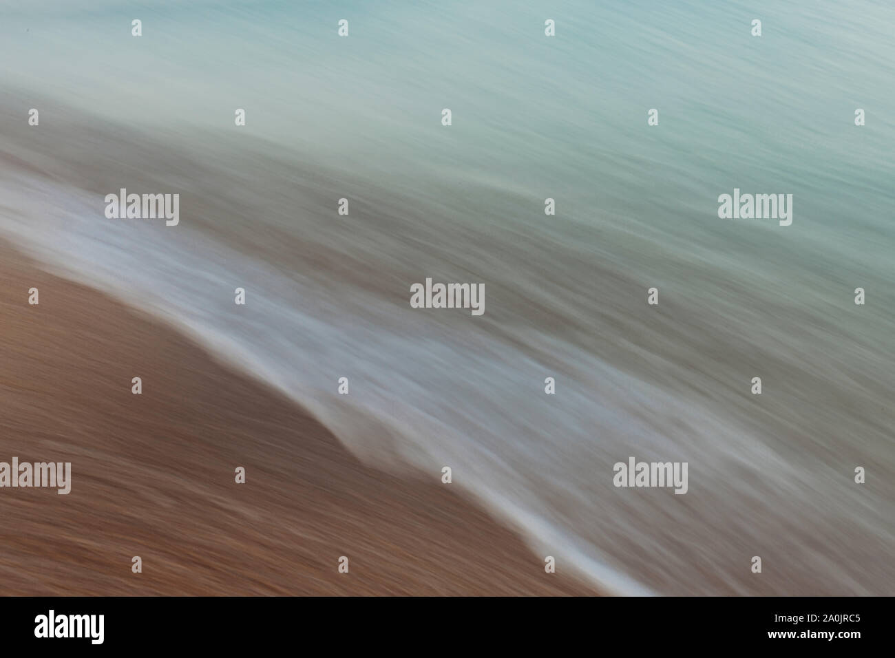 Abstract view of waves on beach Stock Photo - Alamy