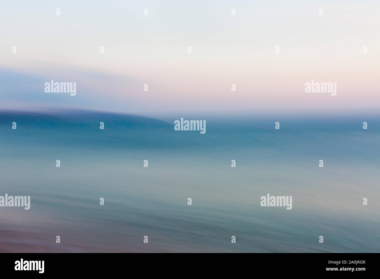 Abstract View of Ocean and Headland at Sunset Stock Photo - Alamy