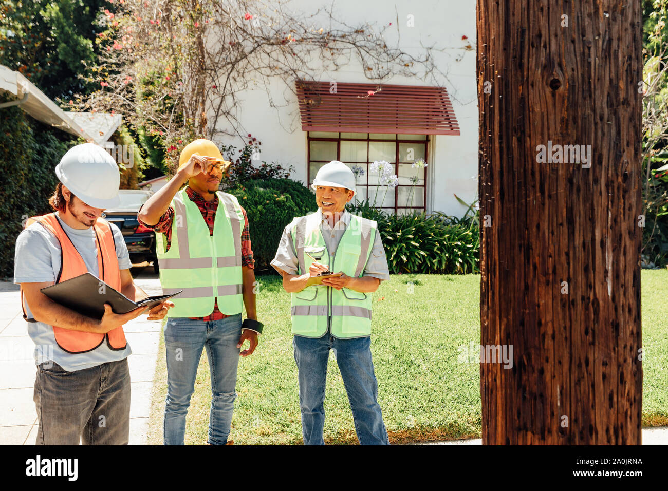 Engineers work on telephone pole Stock Photo - Alamy