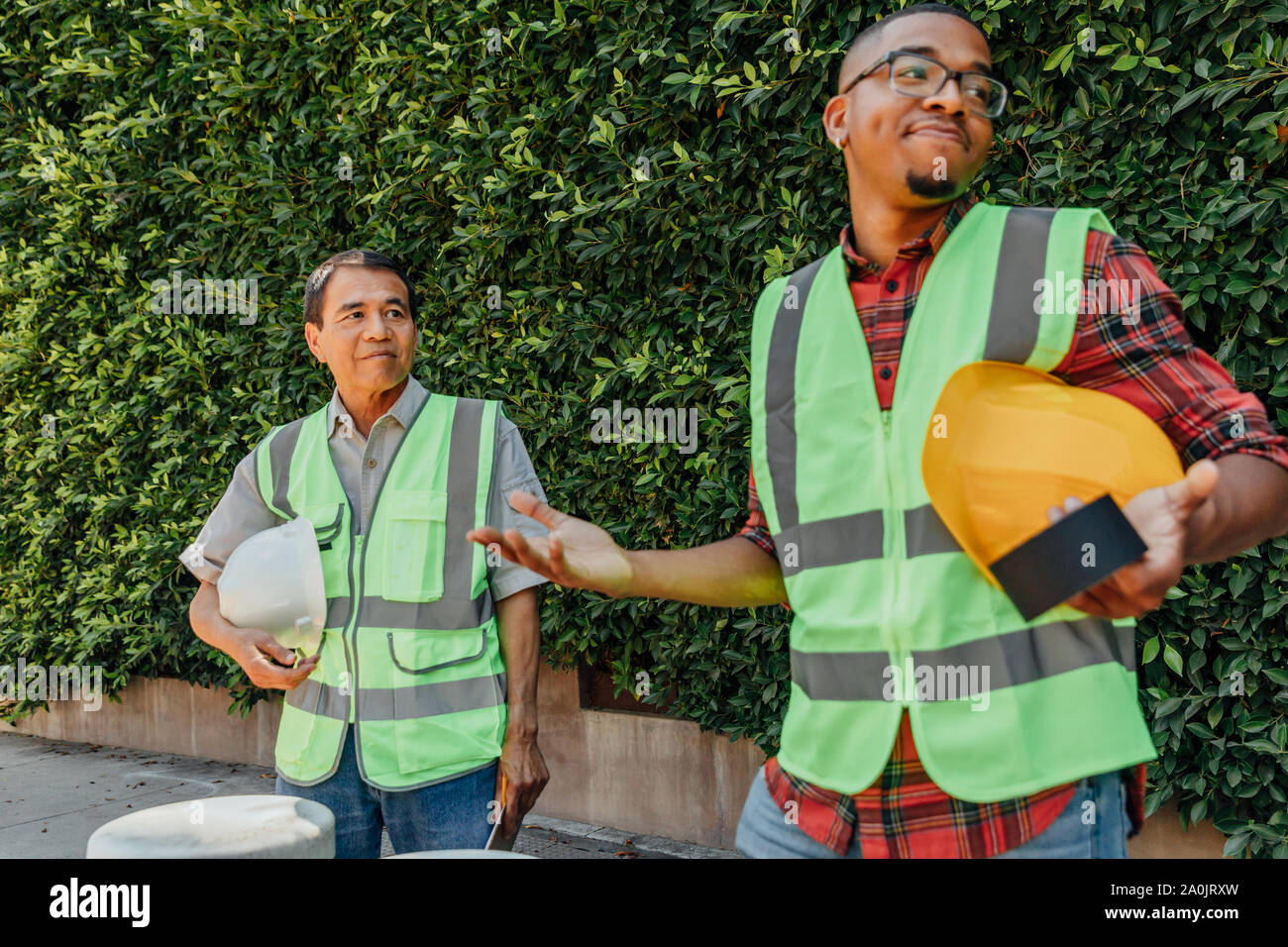 Men on a break outside Stock Photo - Alamy