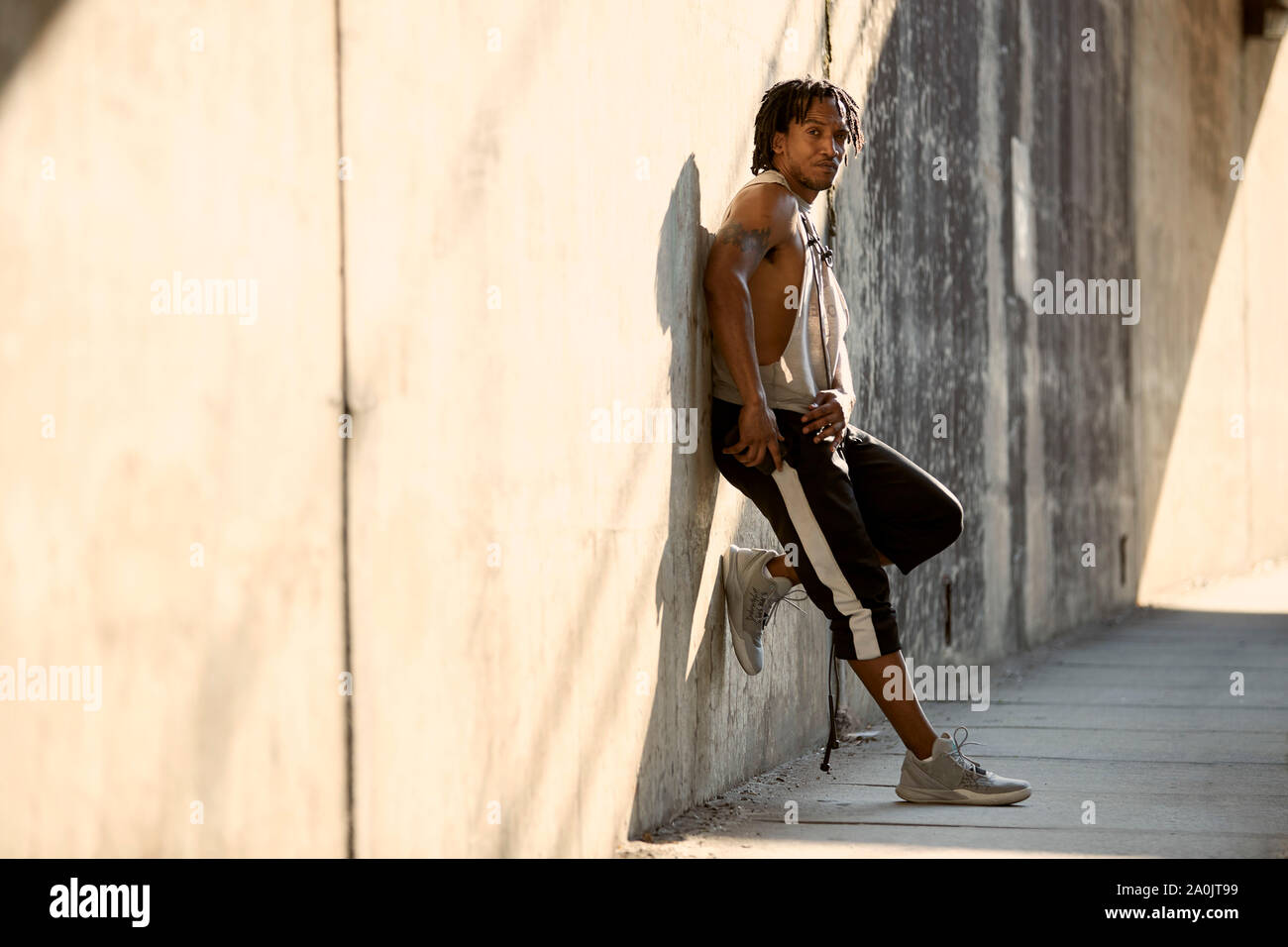 African-American man reaching for phone Stock Photo - Alamy