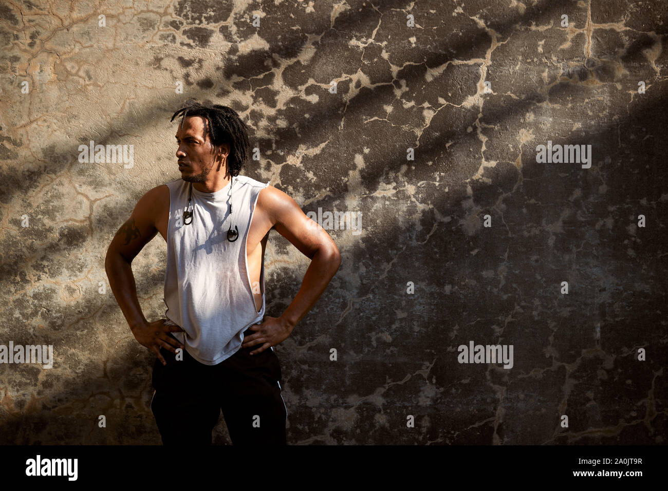 African-American man with hands on hips after workout Stock Photo - Alamy