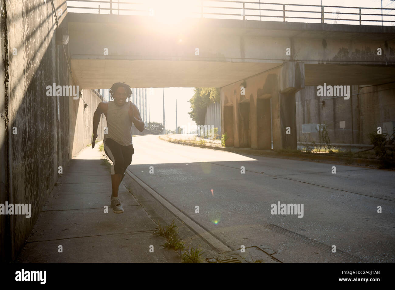 African american man running hi-res stock photography and images - Alamy